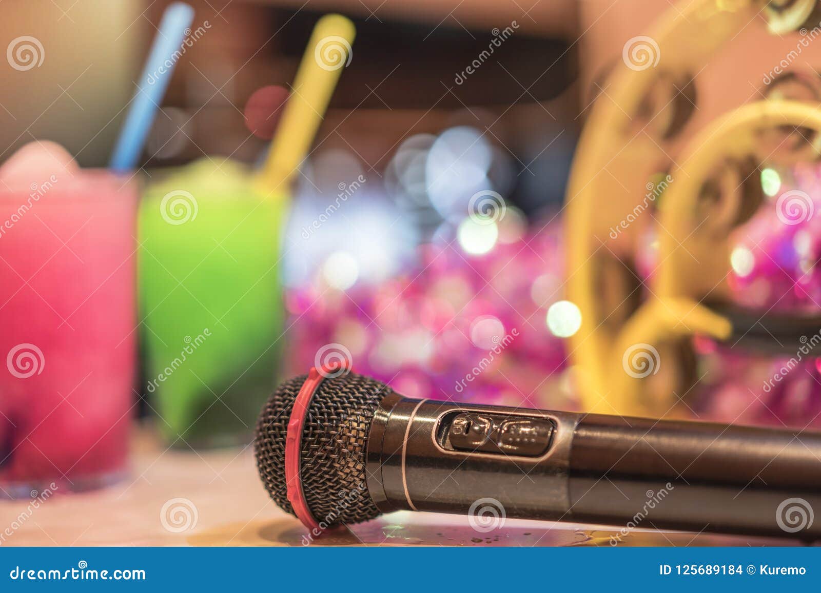 Black Microphone in Karaoke Club, with Remote Controller, Melon Stock ...