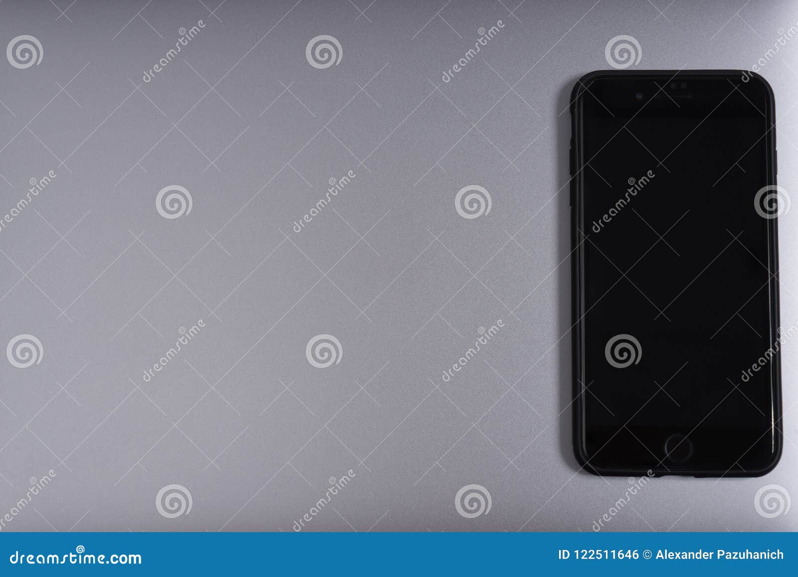 Black Mobile Phone on Grey Metallic Surface. Object. Stock Photo ...