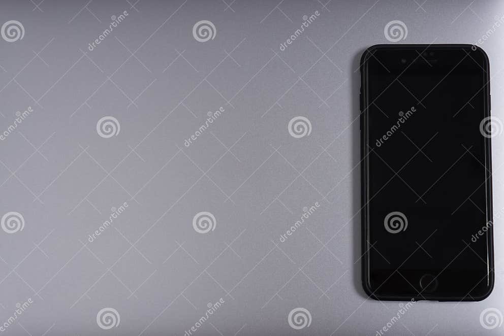 Black Mobile Phone on Grey Metallic Surface. Object. Stock Photo ...