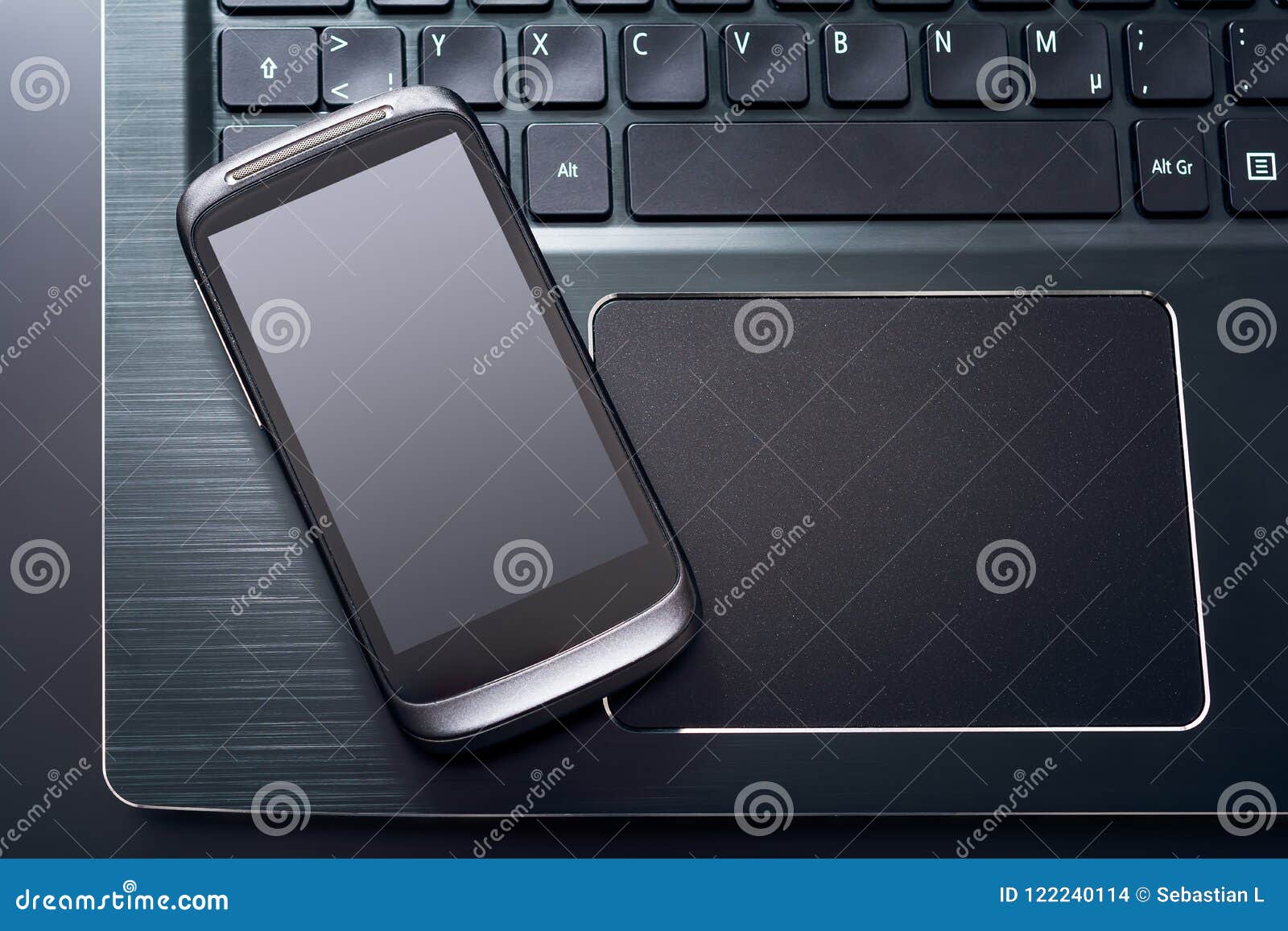 Black Mobile Phone with Reflection Lying on the Left Edge of the ...