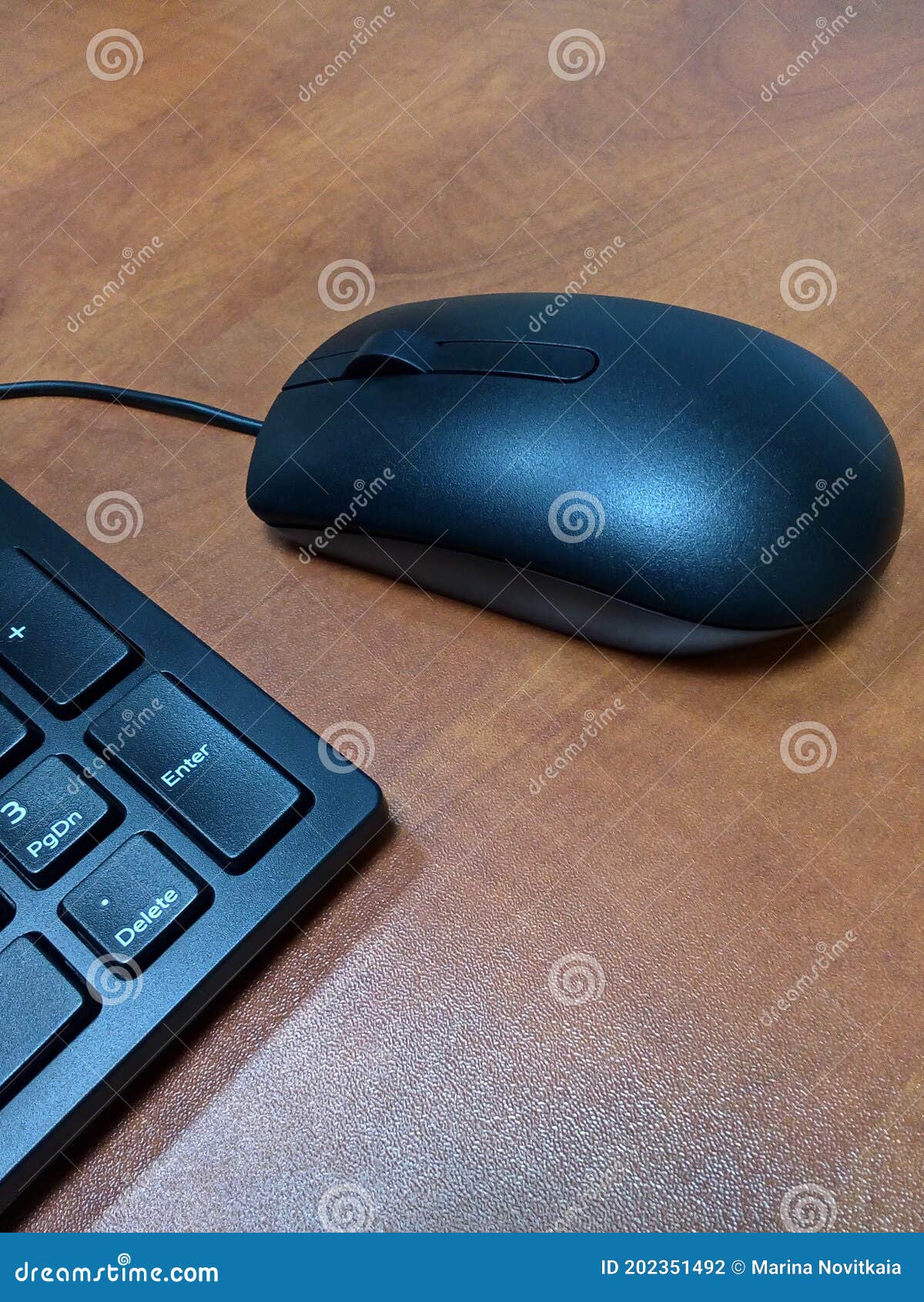 Black Mouse and Part of Keyboard on Working Desk in Office Stock Photo ...