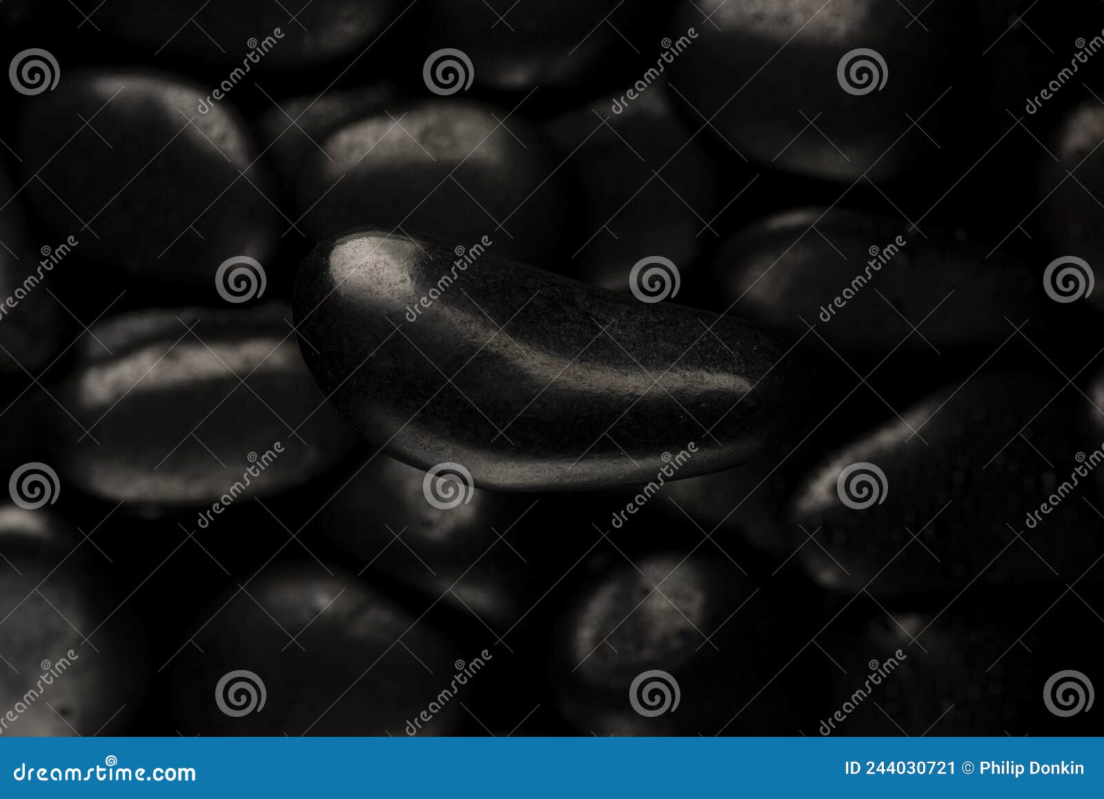 Black Natural Stones Covered in Rain Drops Showing Textures and ...