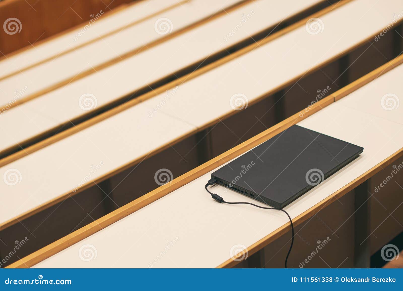 Black Notebook Computer on the Desk in University Auditorium Stock ...
