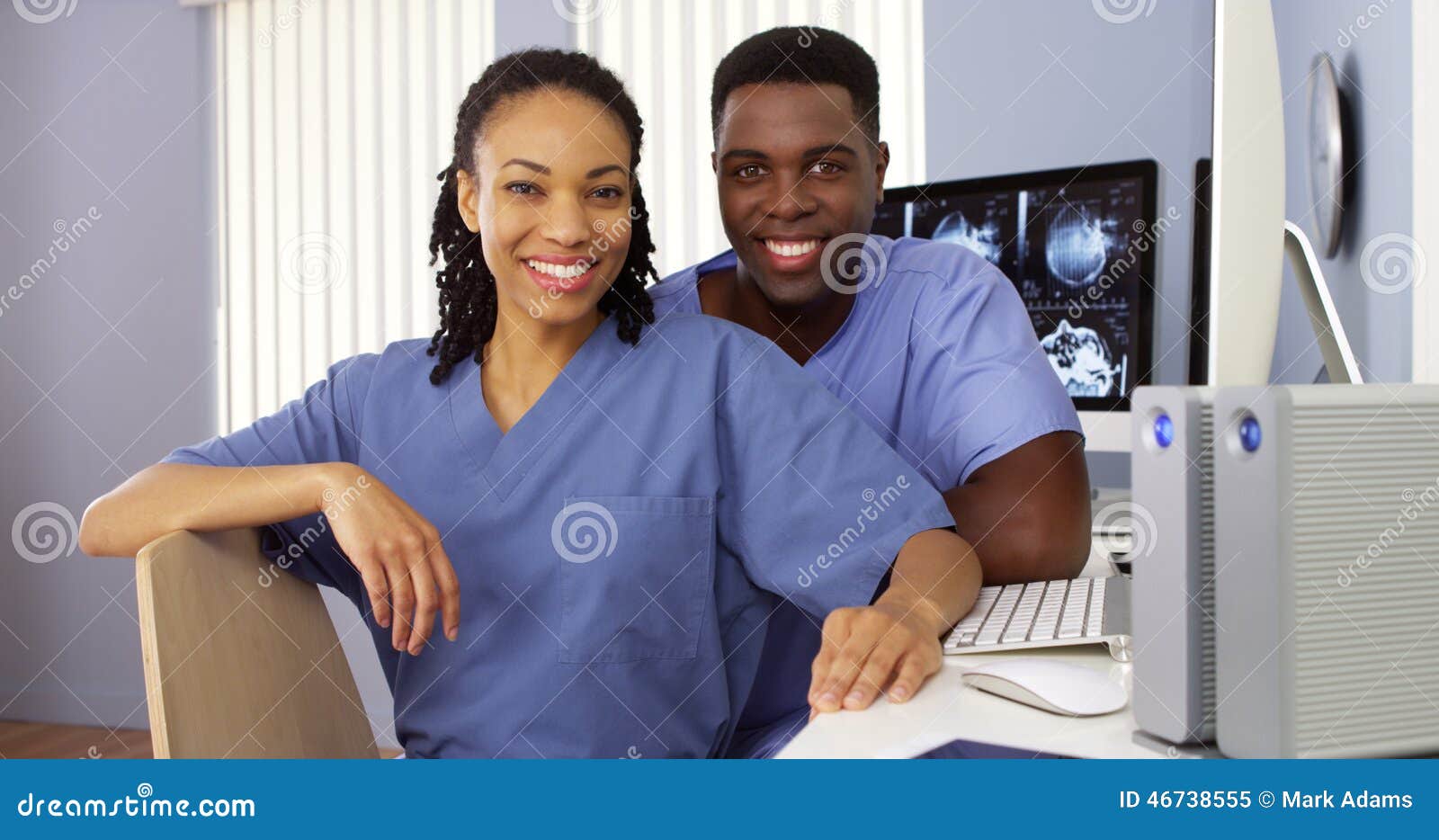 Black Nurses in Nurses Station Sitting at Computer Stock Image - Image ...