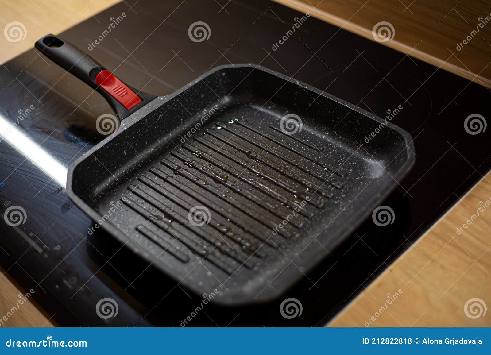 Black Oily Grill Pan is Heating on Electrical Ceramic Hob for Burger ...