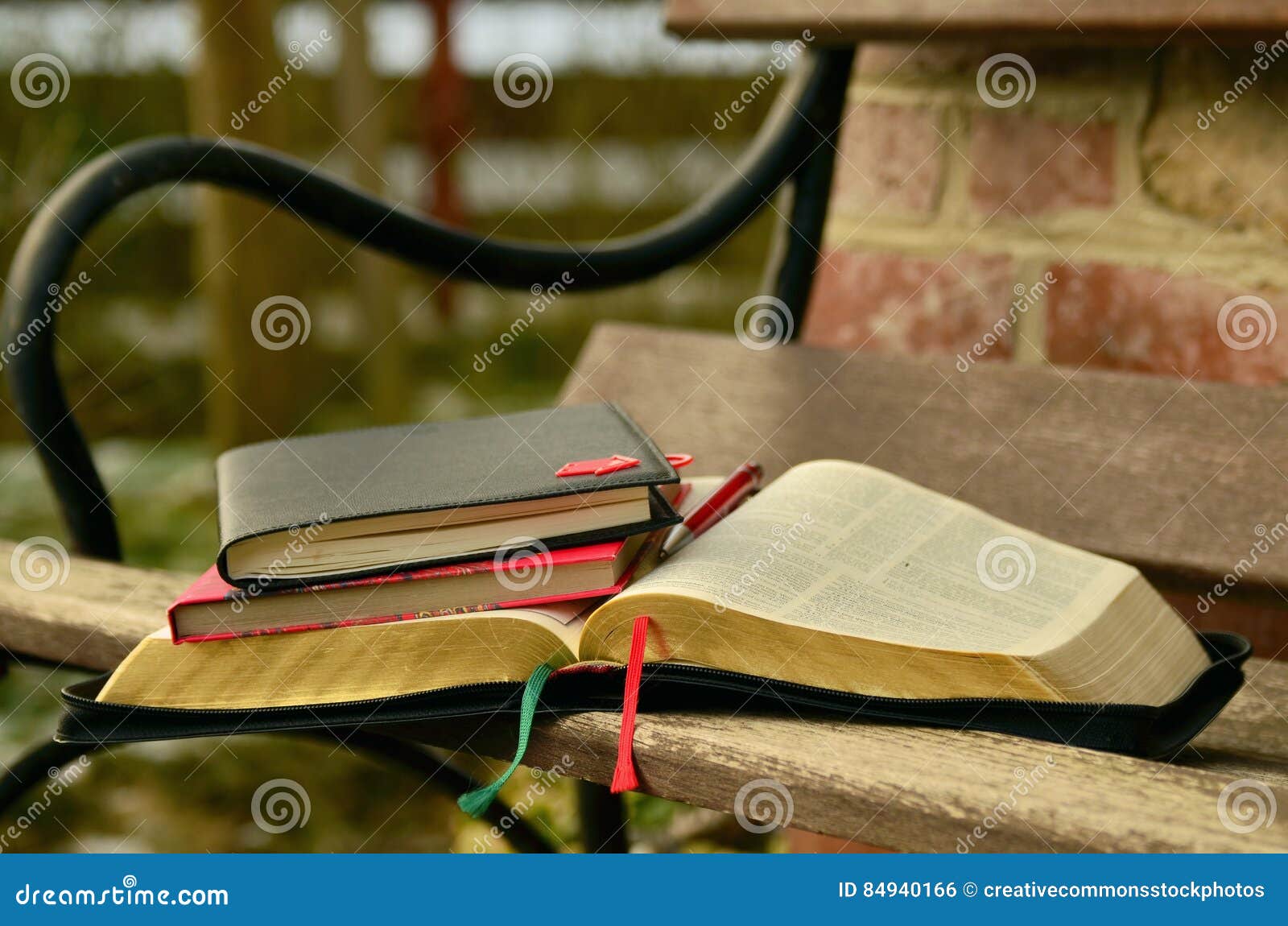 Black Open Book On The Brown Wooden Bench Picture. Image: 84940166