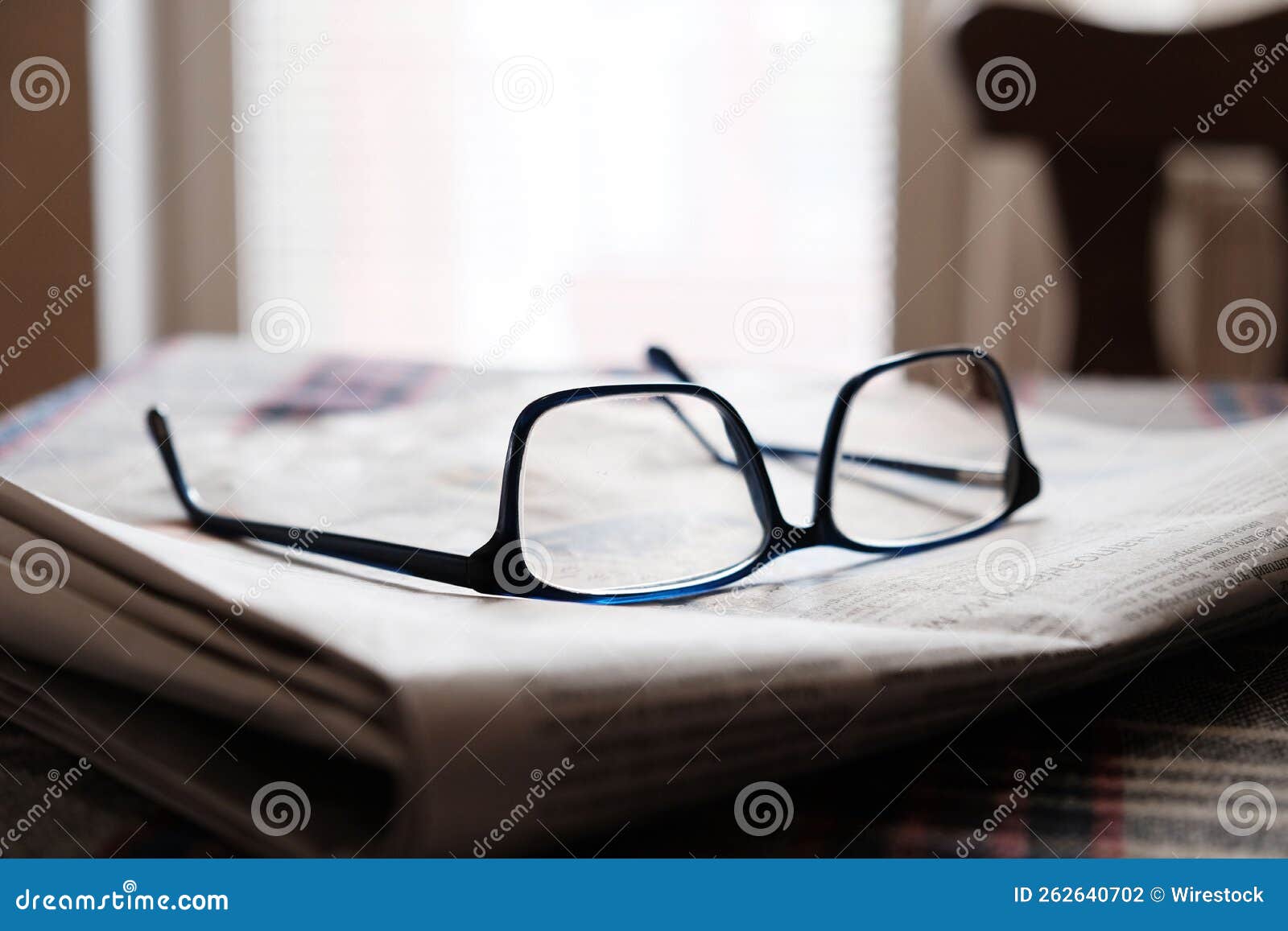 Black Optical Eyeglasses on the Stack of Newspapers Stock Photo - Image ...