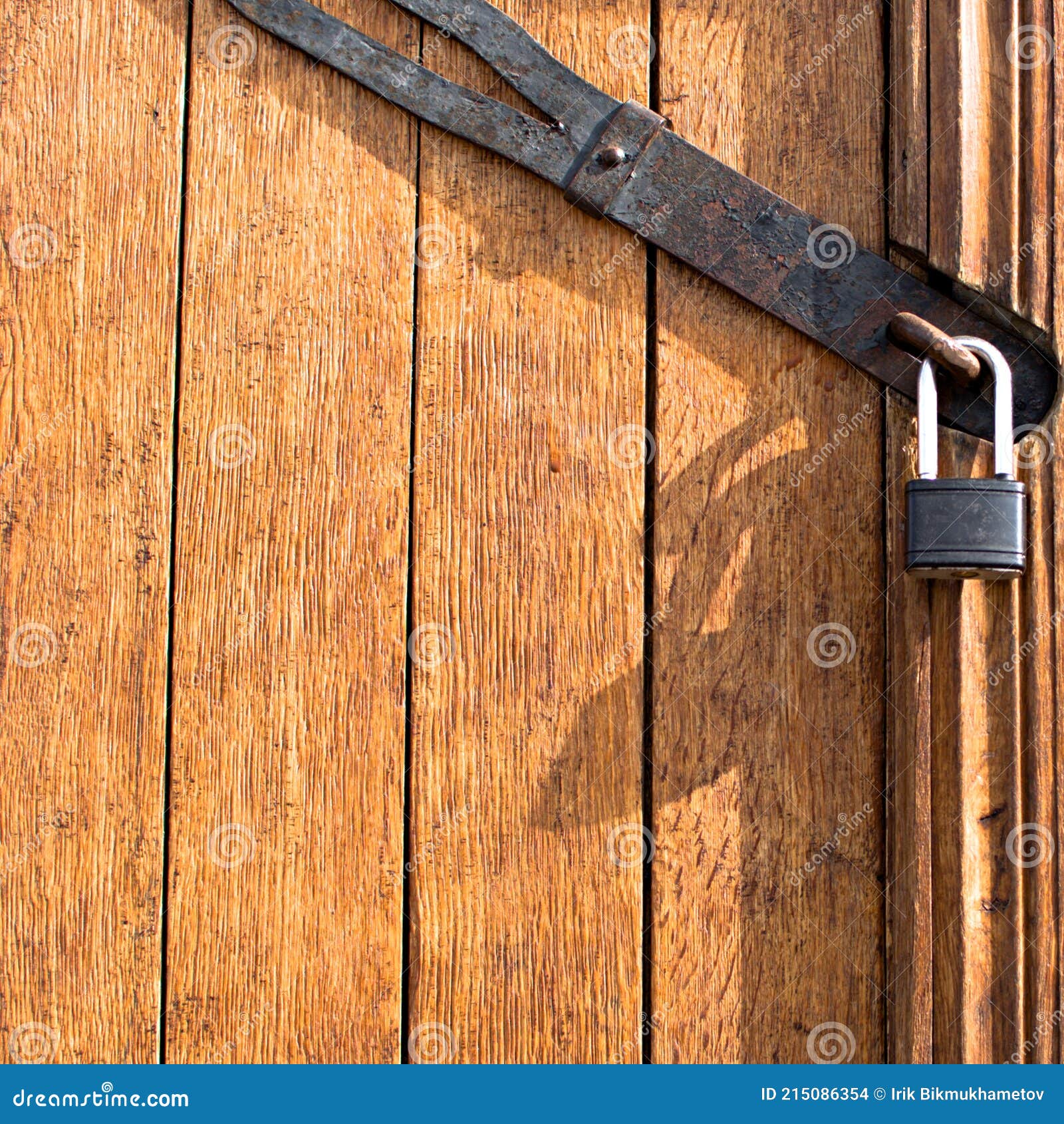 Black Padlock on Wooden Door Stock Photo - Image of retro, rusty: 215086354