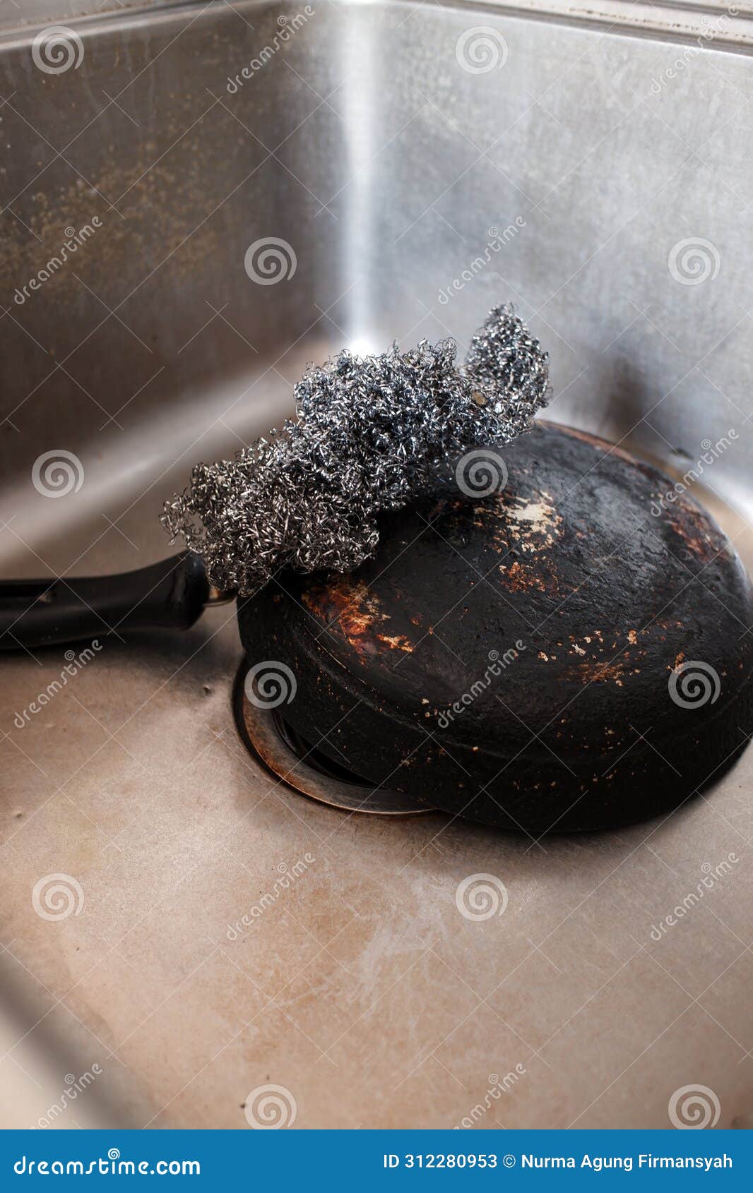 A Black Pan Behind and a Wire Sponge Stock Image - Image of cake ...