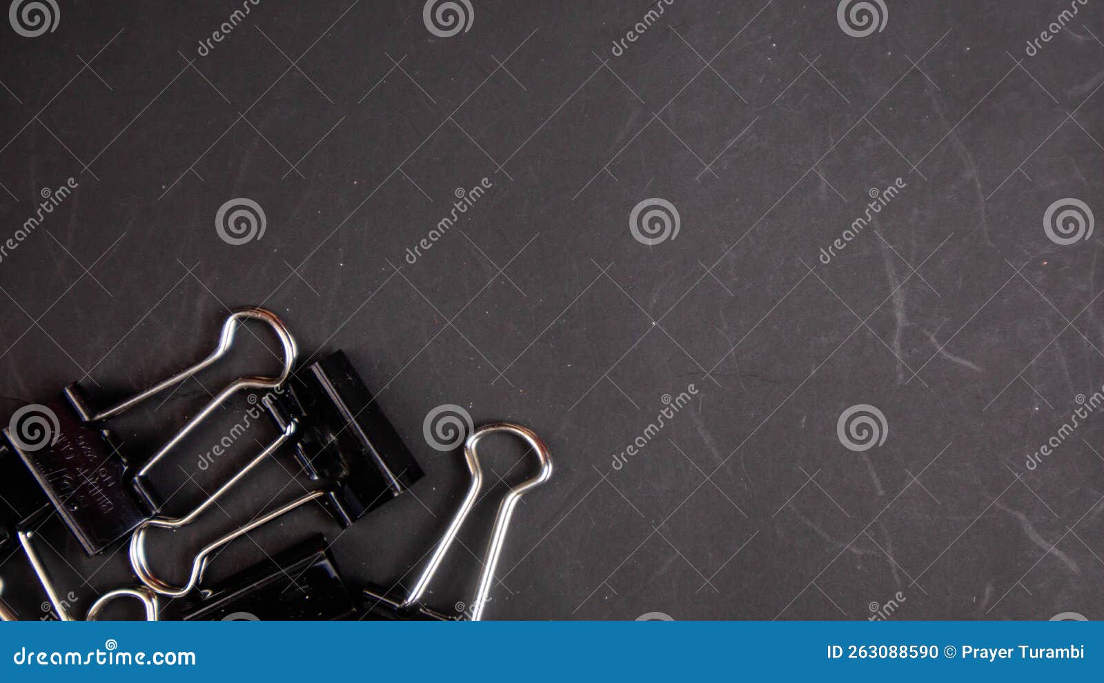 A Black Paper Clip on a Black Background Stock Photo - Image of ...