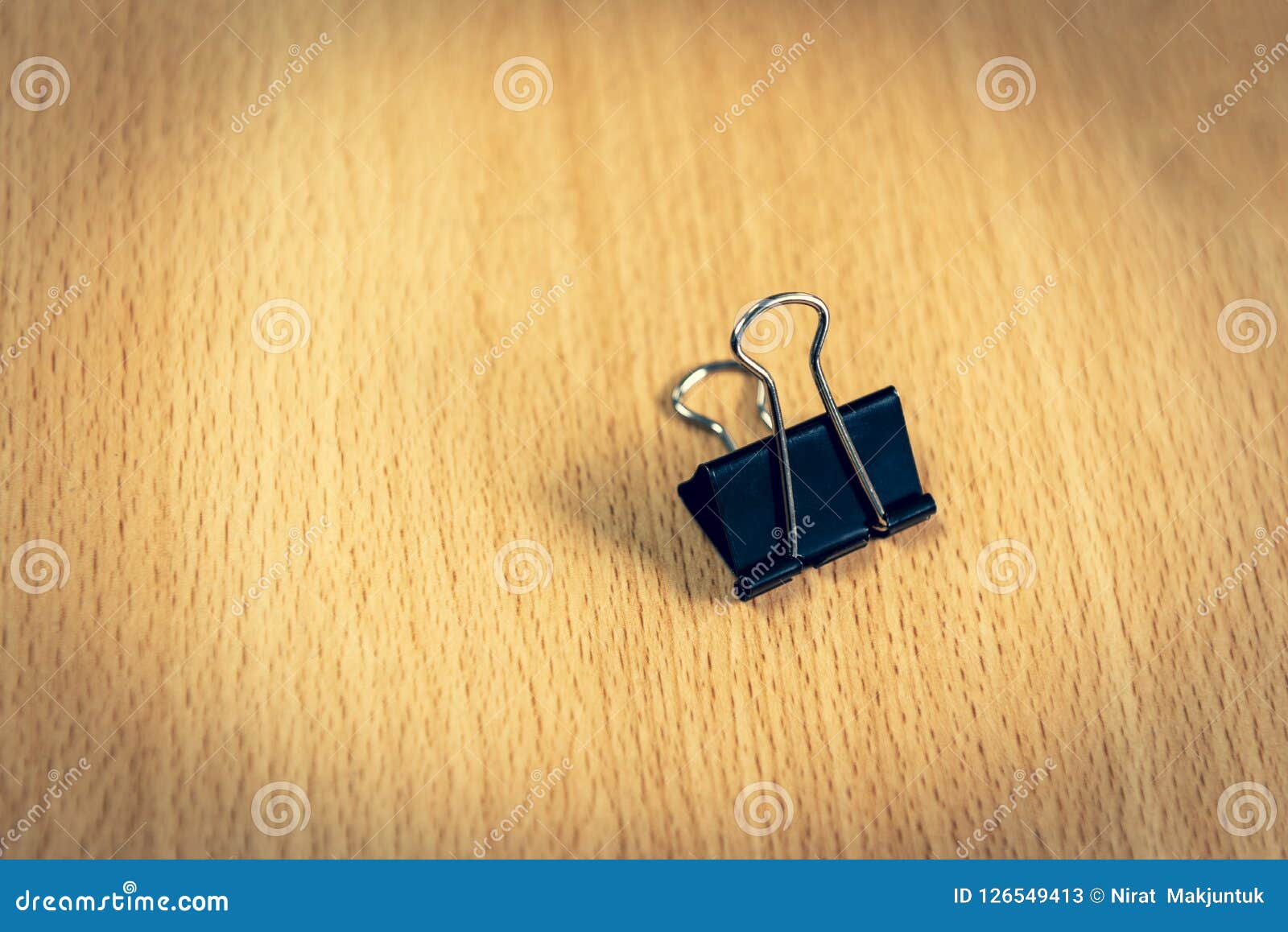 Black paper clip on desk stock image. Image of clip - 126549413