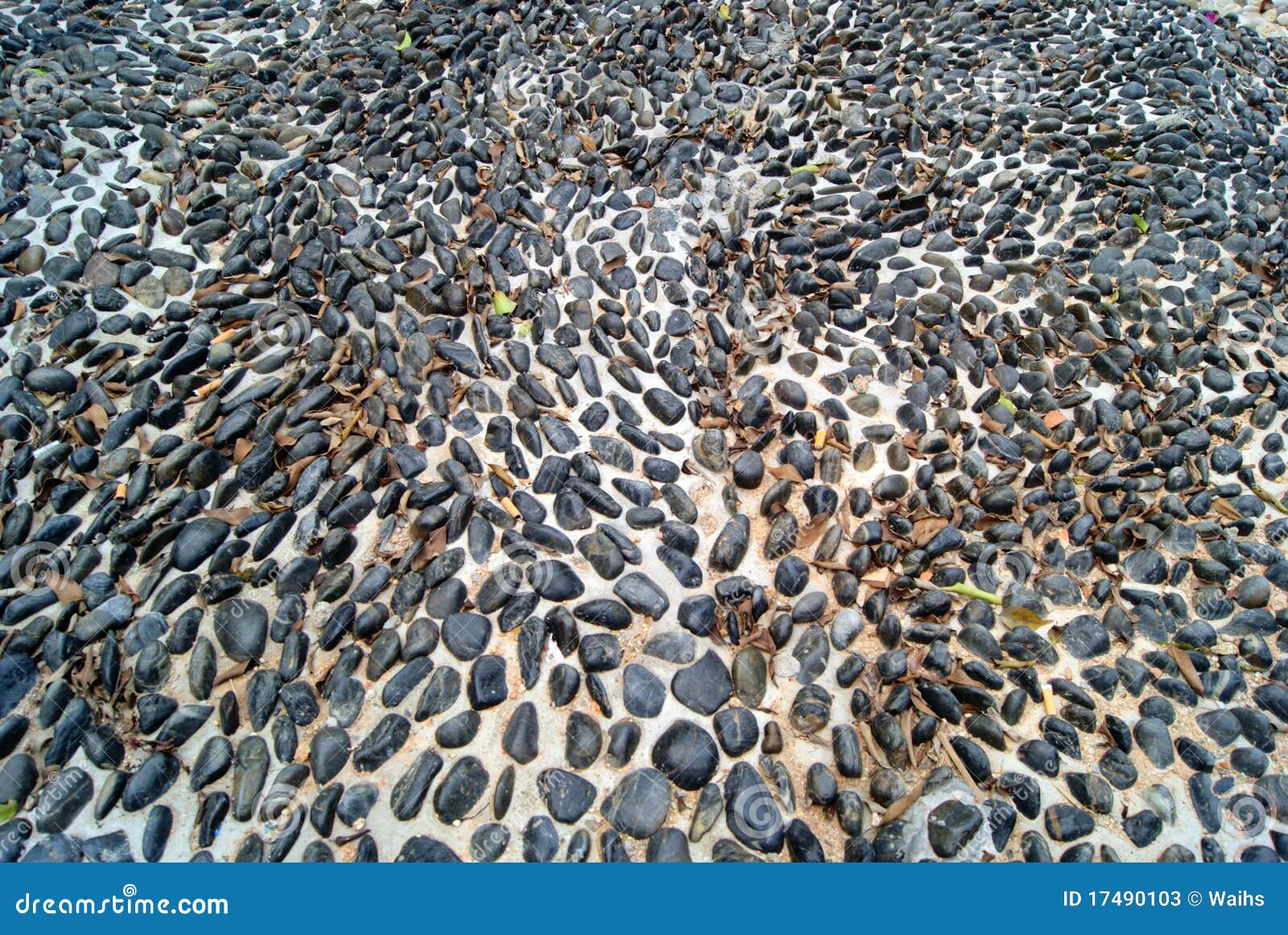 Black pebble-paved ground stock image. Image of workers - 17490103