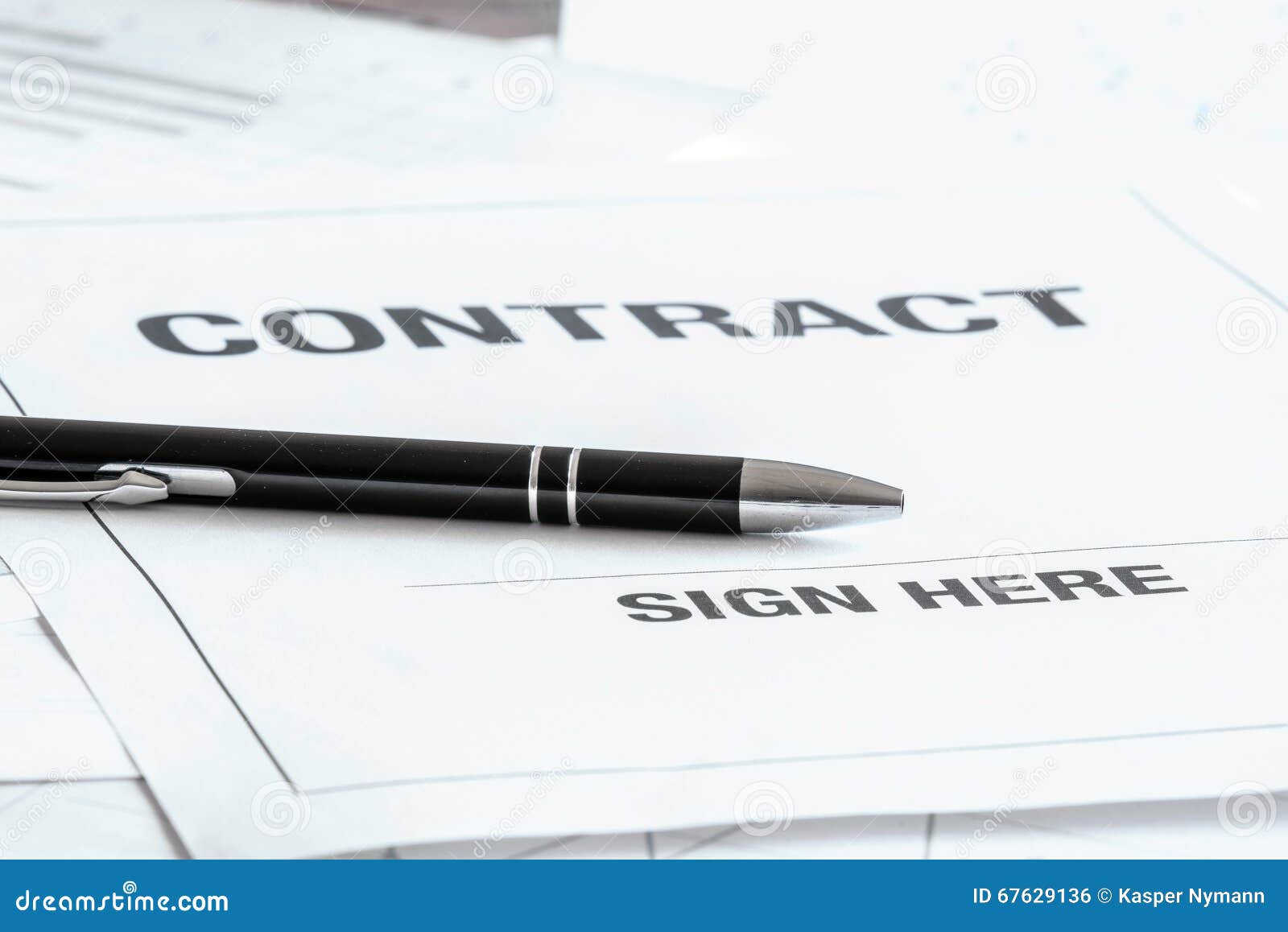 Black pen on a contract stock photo. Image of information - 67629136