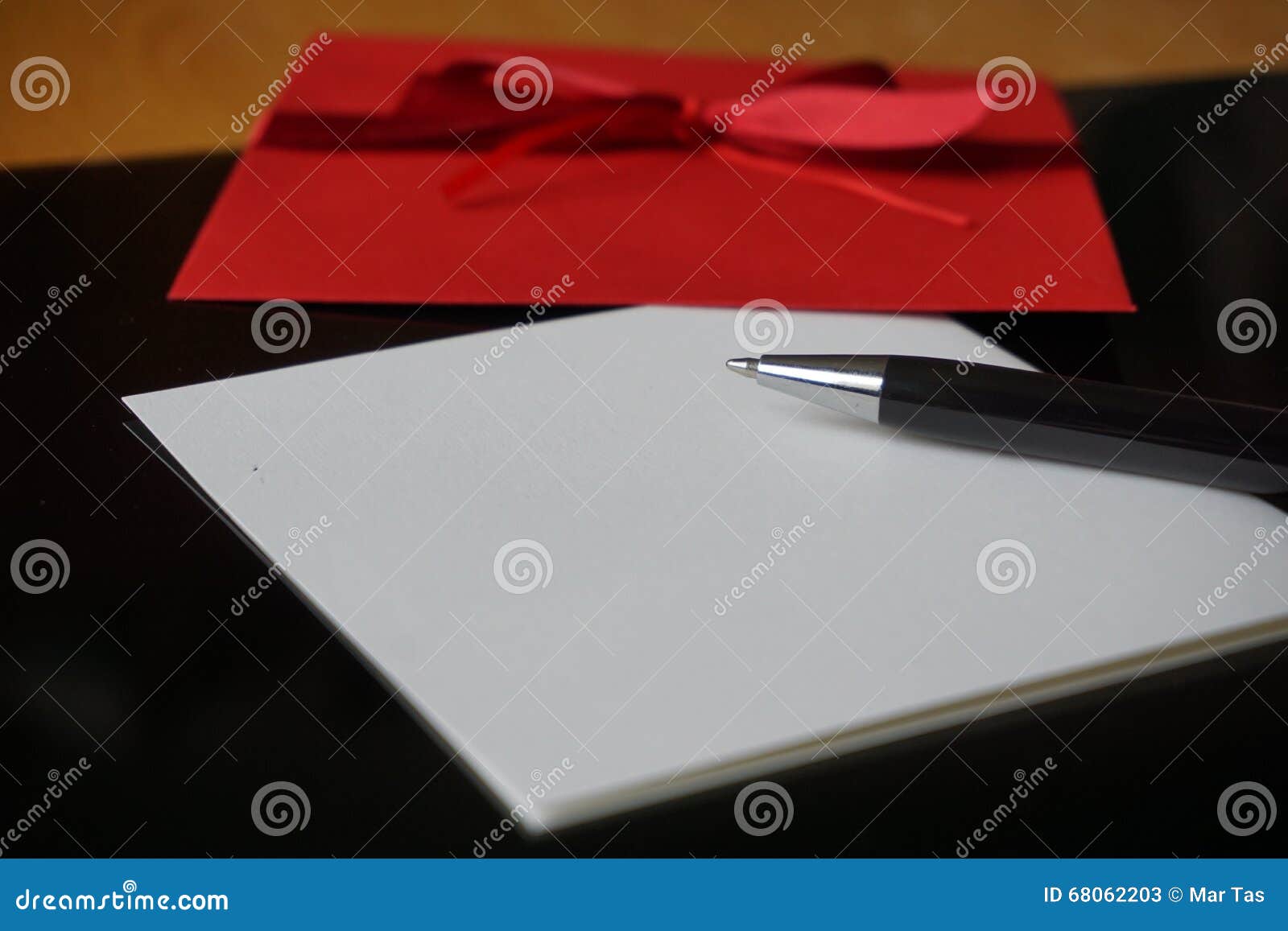 Black Pen Writing Announcement Letter with a Decorated Red Envelope ...