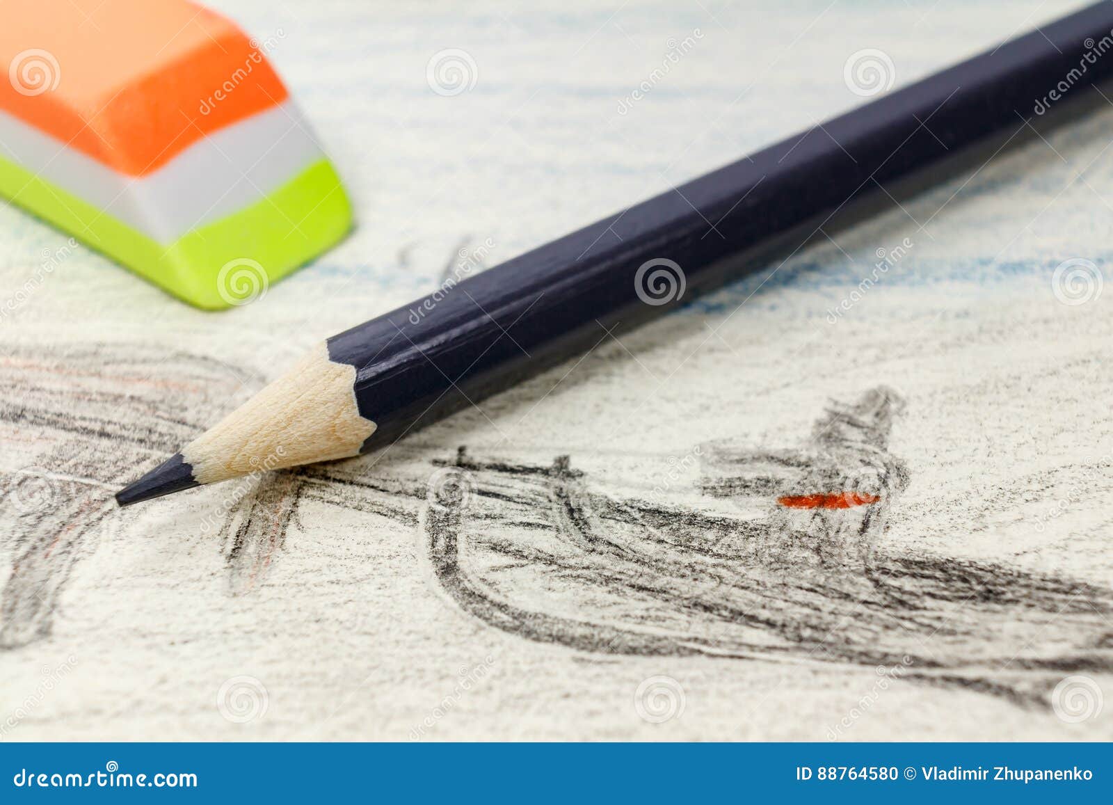 Black Pencil and Eraser on the Background of Children`s Drawing Stock ...