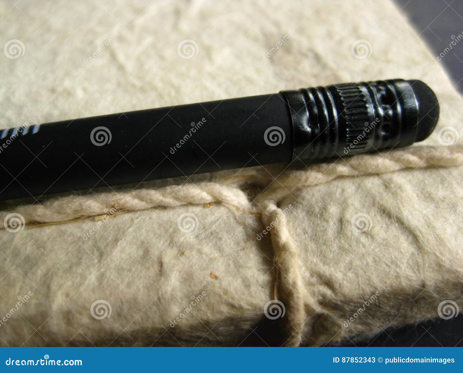 Black-pencil-on-string-binded-notebook Picture. Image: 87852343