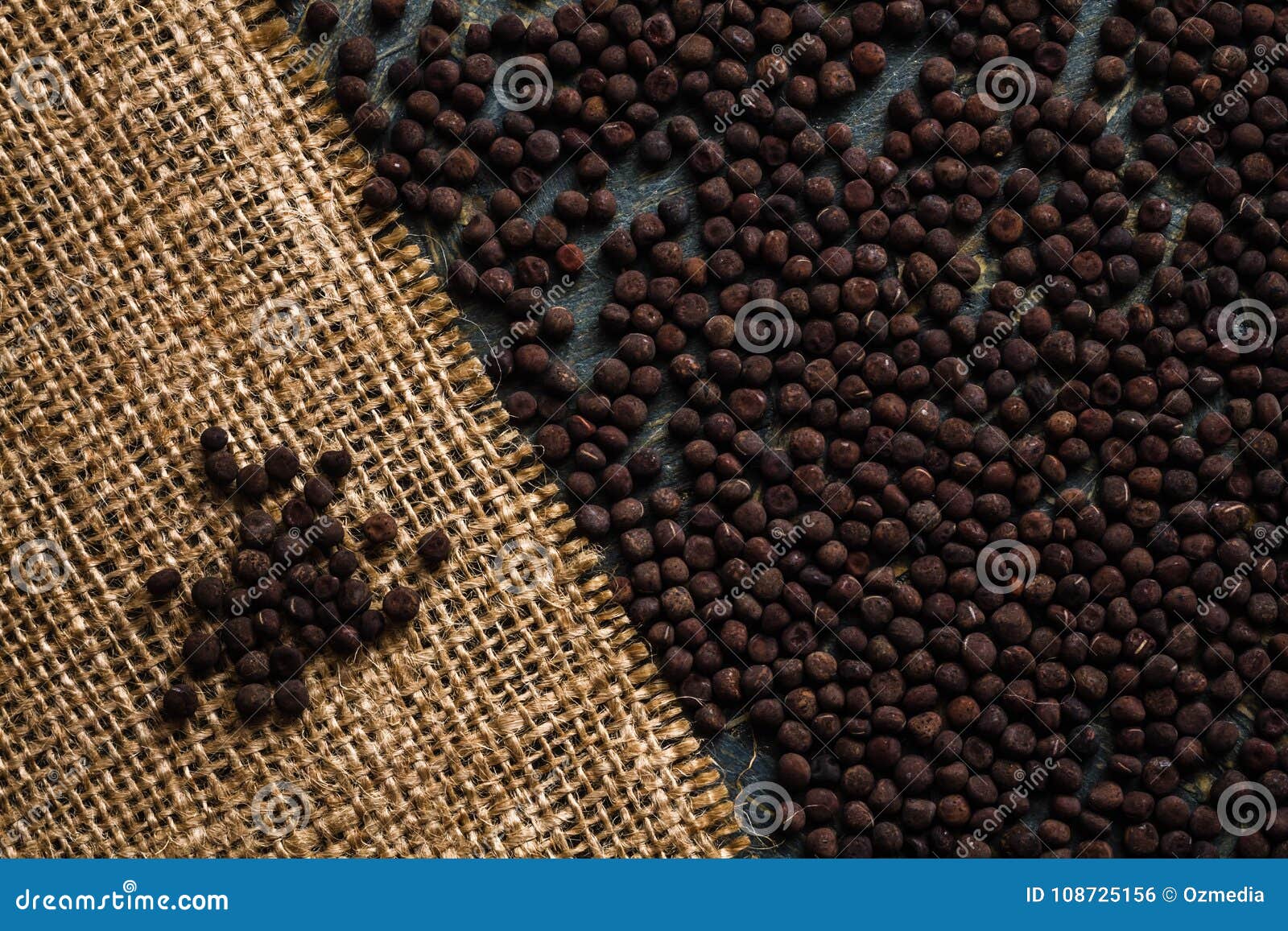 Black Pepper Pile on Blue Table and Burlap Fabric Sheet Stock Photo ...