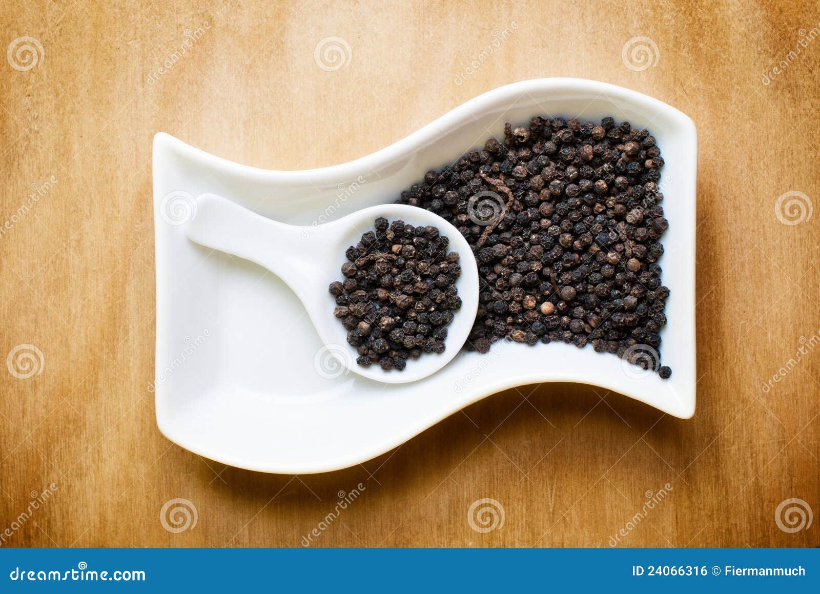 Black pepper on wood table stock photo. Image of plate - 24066316