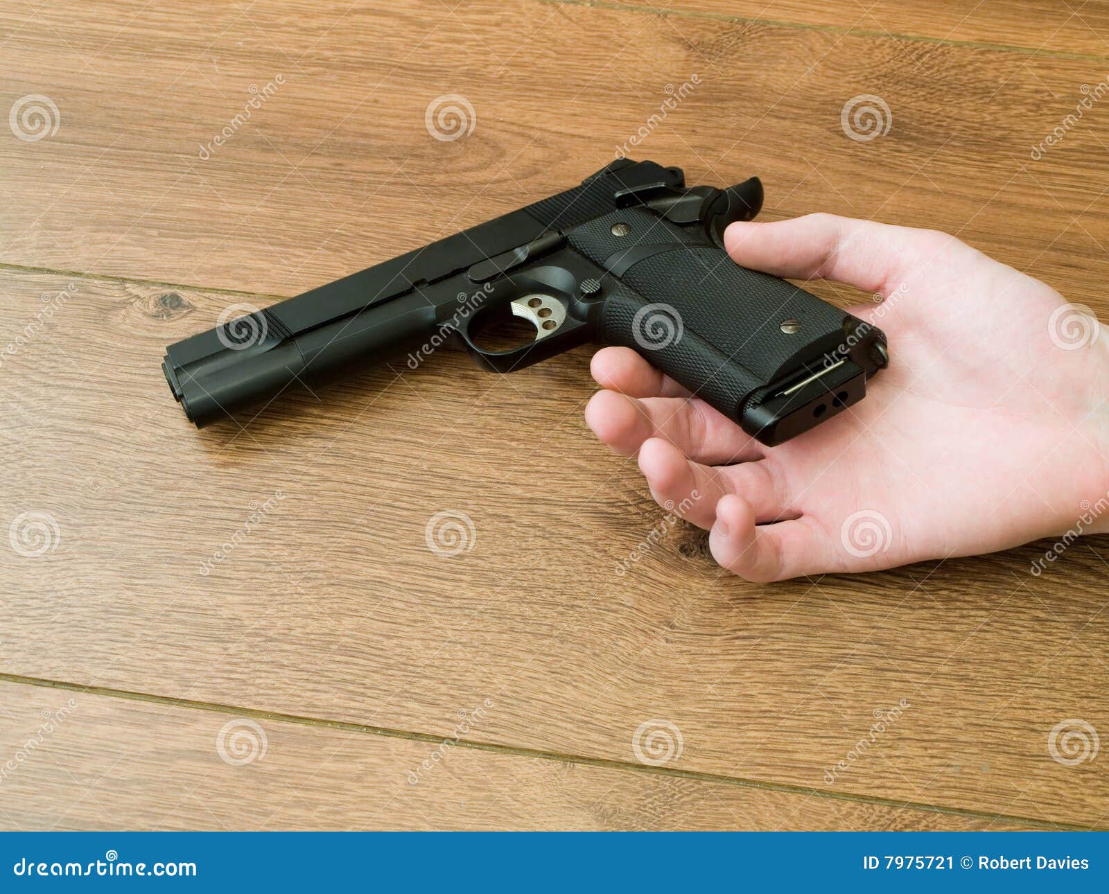 Black Pistol Gun in Dead Hand Stock Image - Image of pistol, metal: 7975721