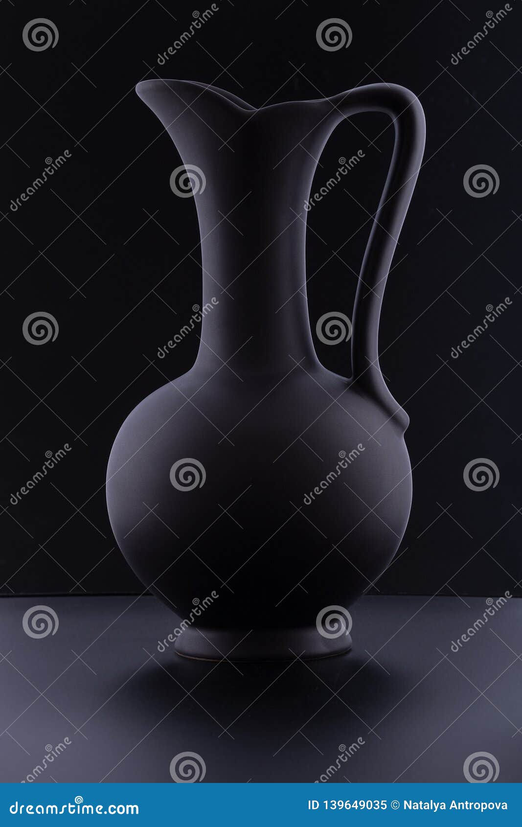 Black Pitcher, Outlined with Light, on a Black Background. Classic ...