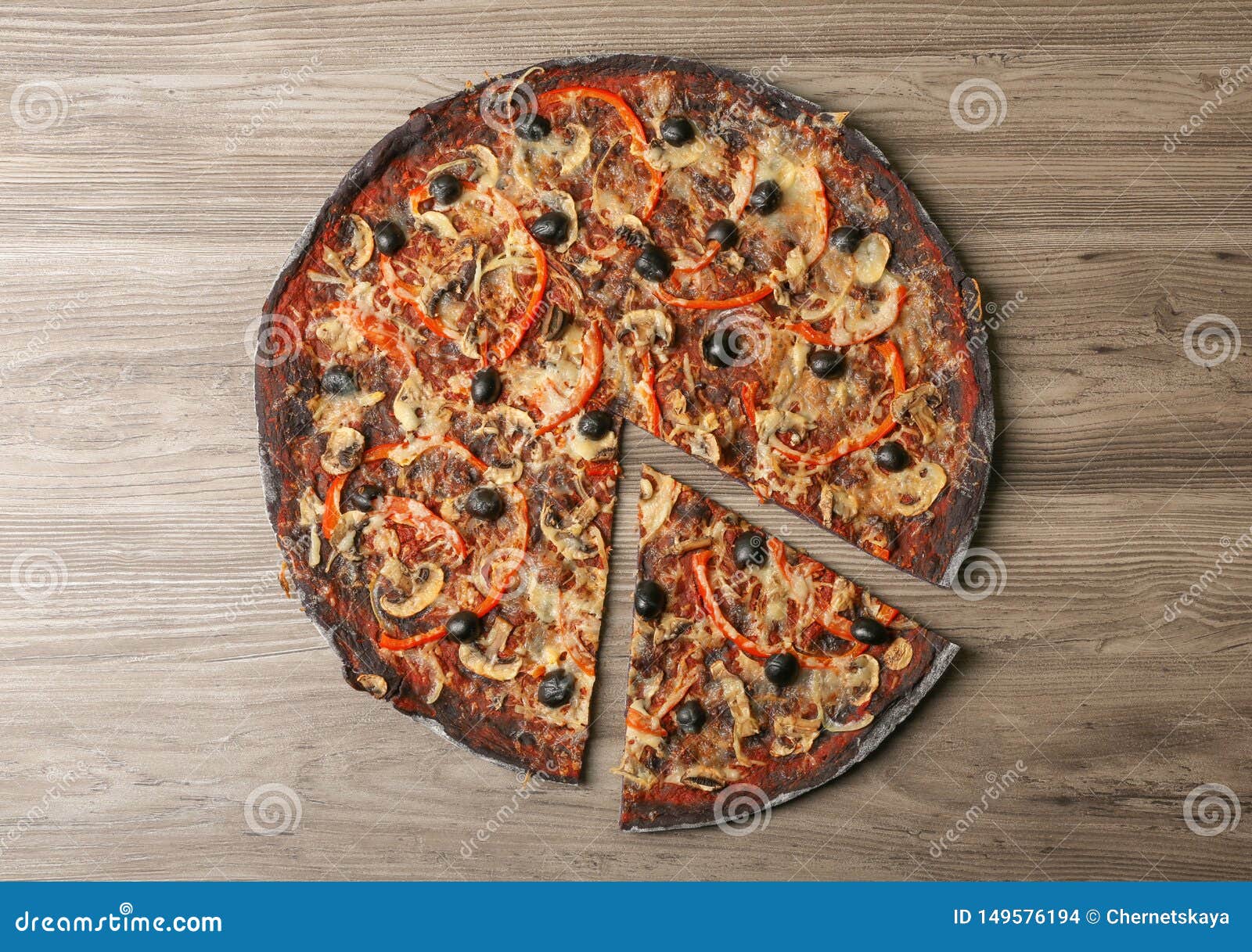 Black Pizza and Cut Slice on Wooden Table Stock Photo - Image of ...