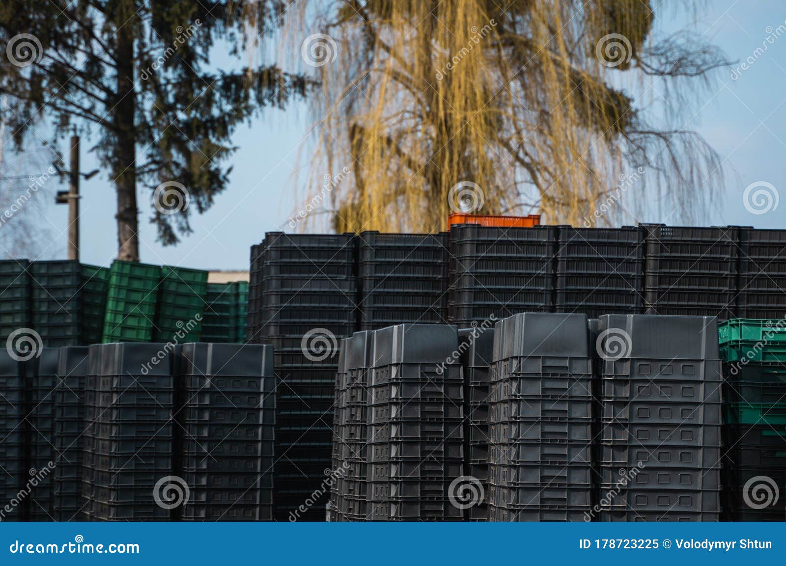 Black Plastic Boxes in a Warehouse Outdoor. Stock Image - Image of pile ...