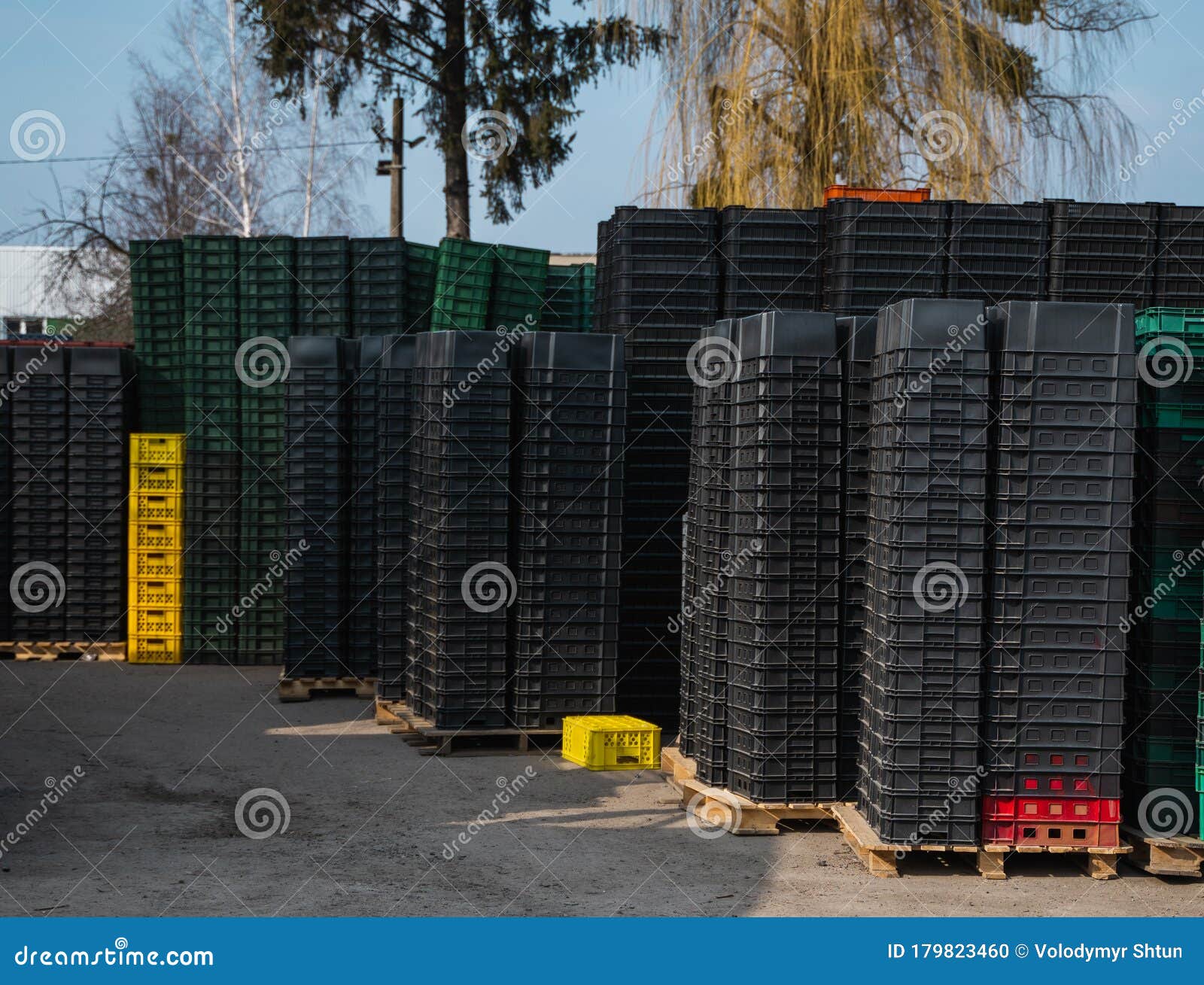 Black Plastic Boxes in a Warehouse Outdoor. Stock Photo - Image of pile ...