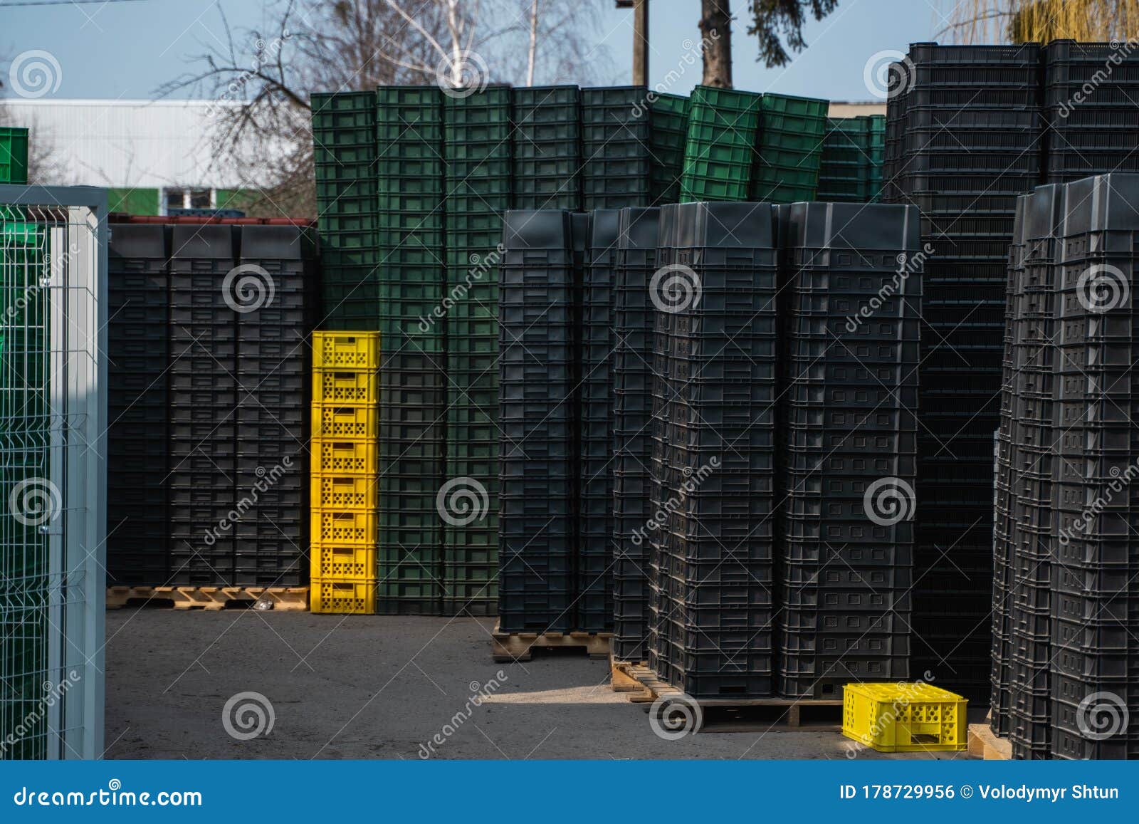 Black Plastic Boxes in a Warehouse Outdoor. Stock Photo - Image of ...