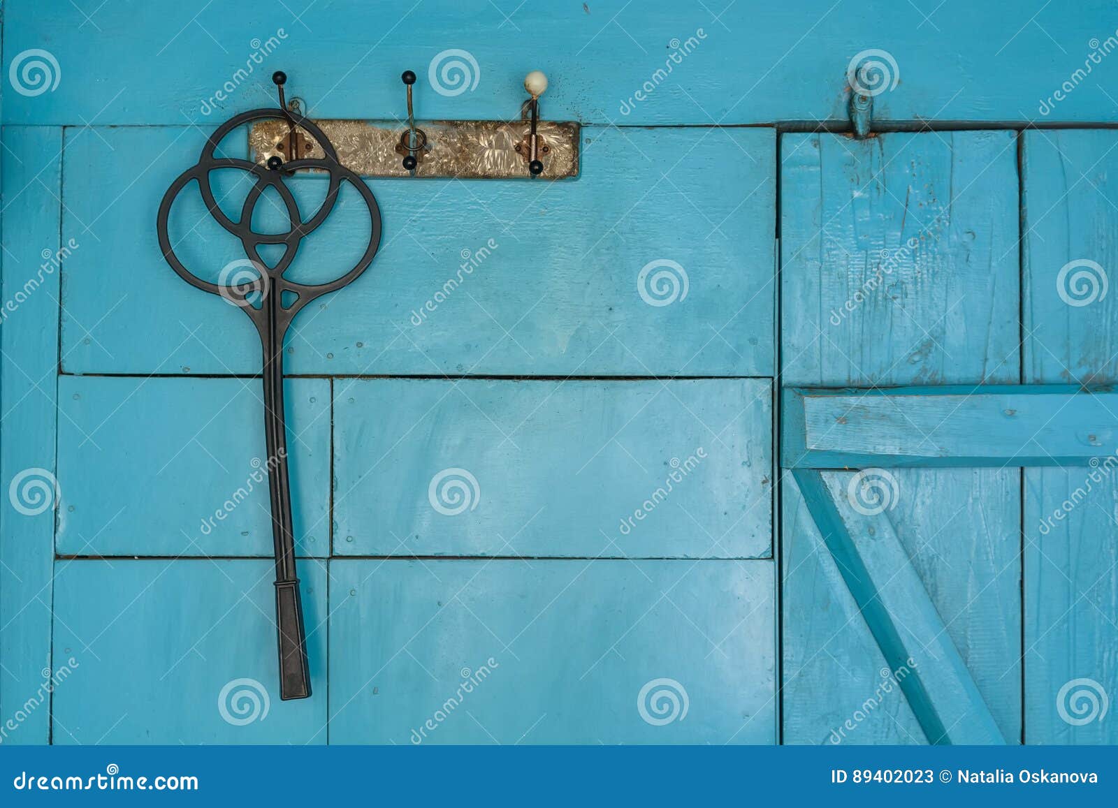 Black Plastic Carpet Beater Hangs on Blue Wall Stock Image - Image of ...