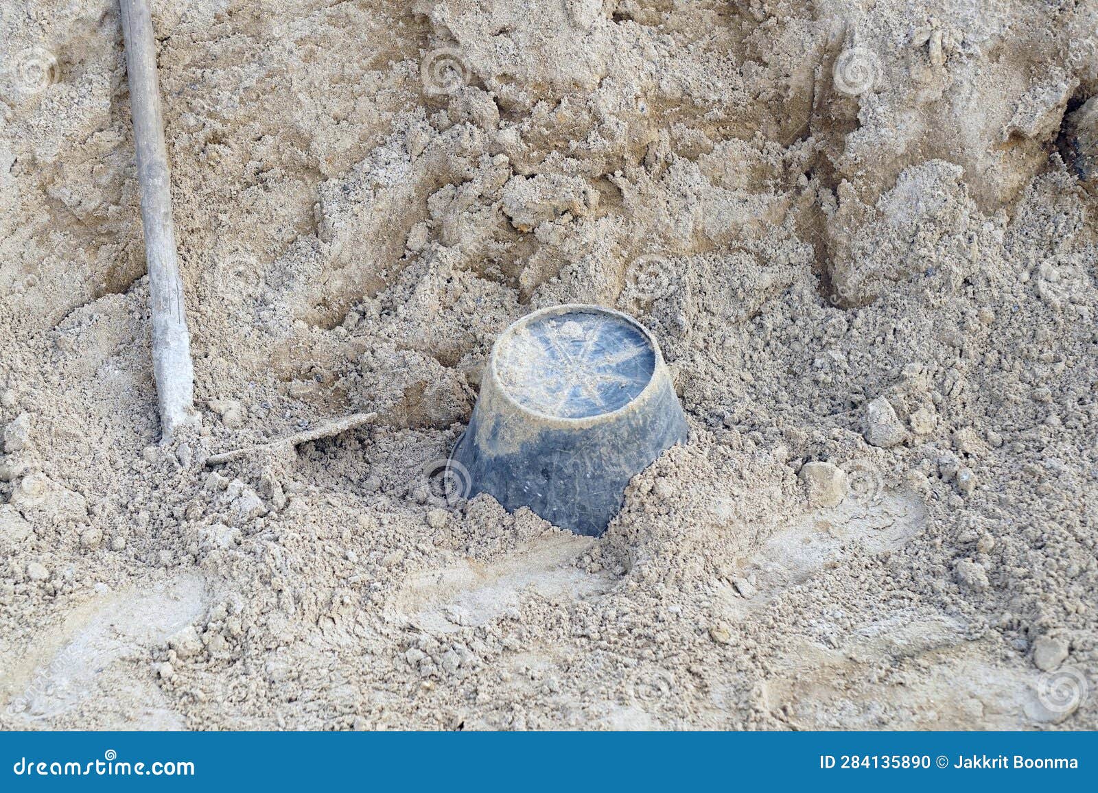 A Black Plastic Cement Bucket and Digging Shovel in the Construction ...