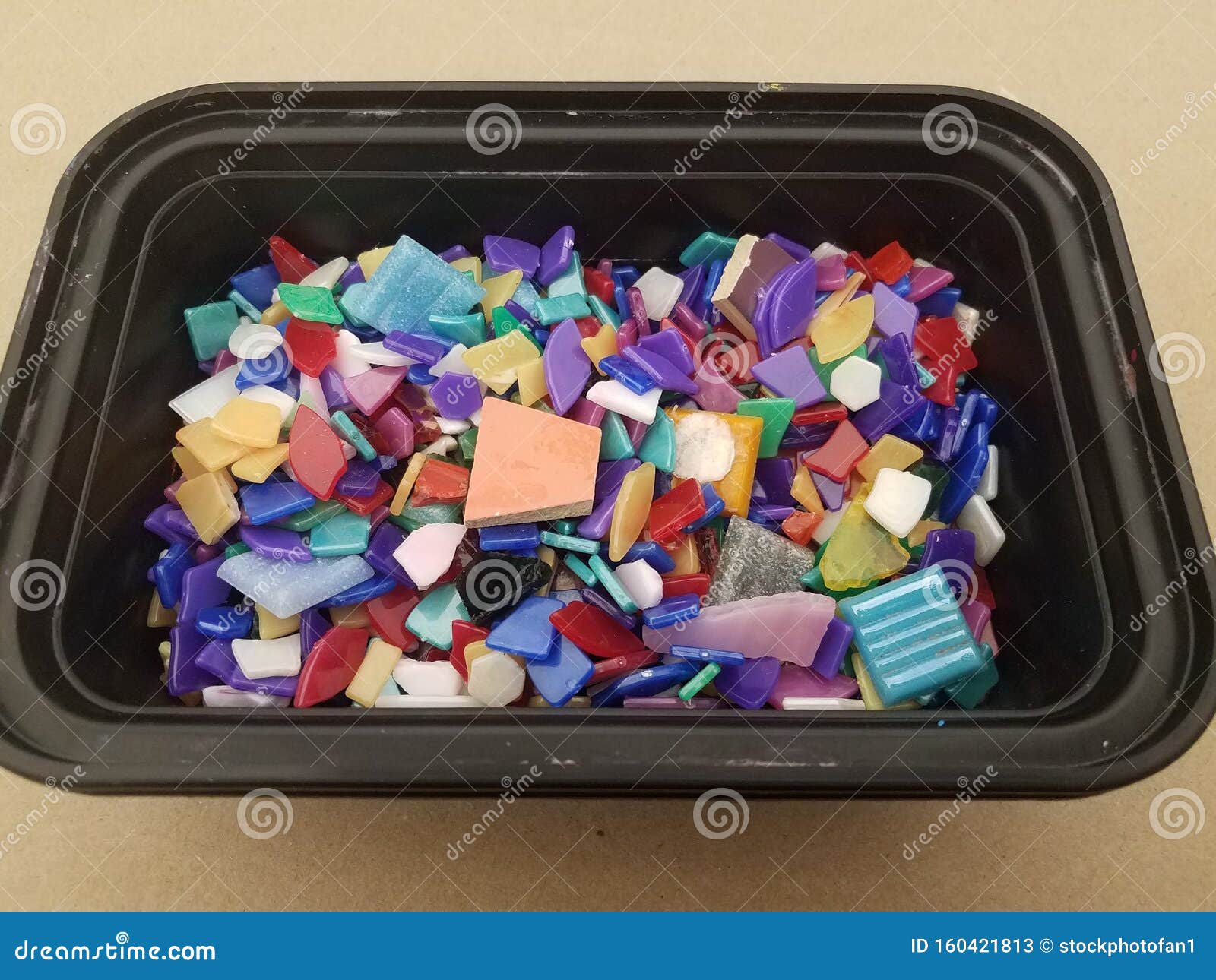 Black Plastic Container of Small Colorful Plastic and Glass and Tile ...