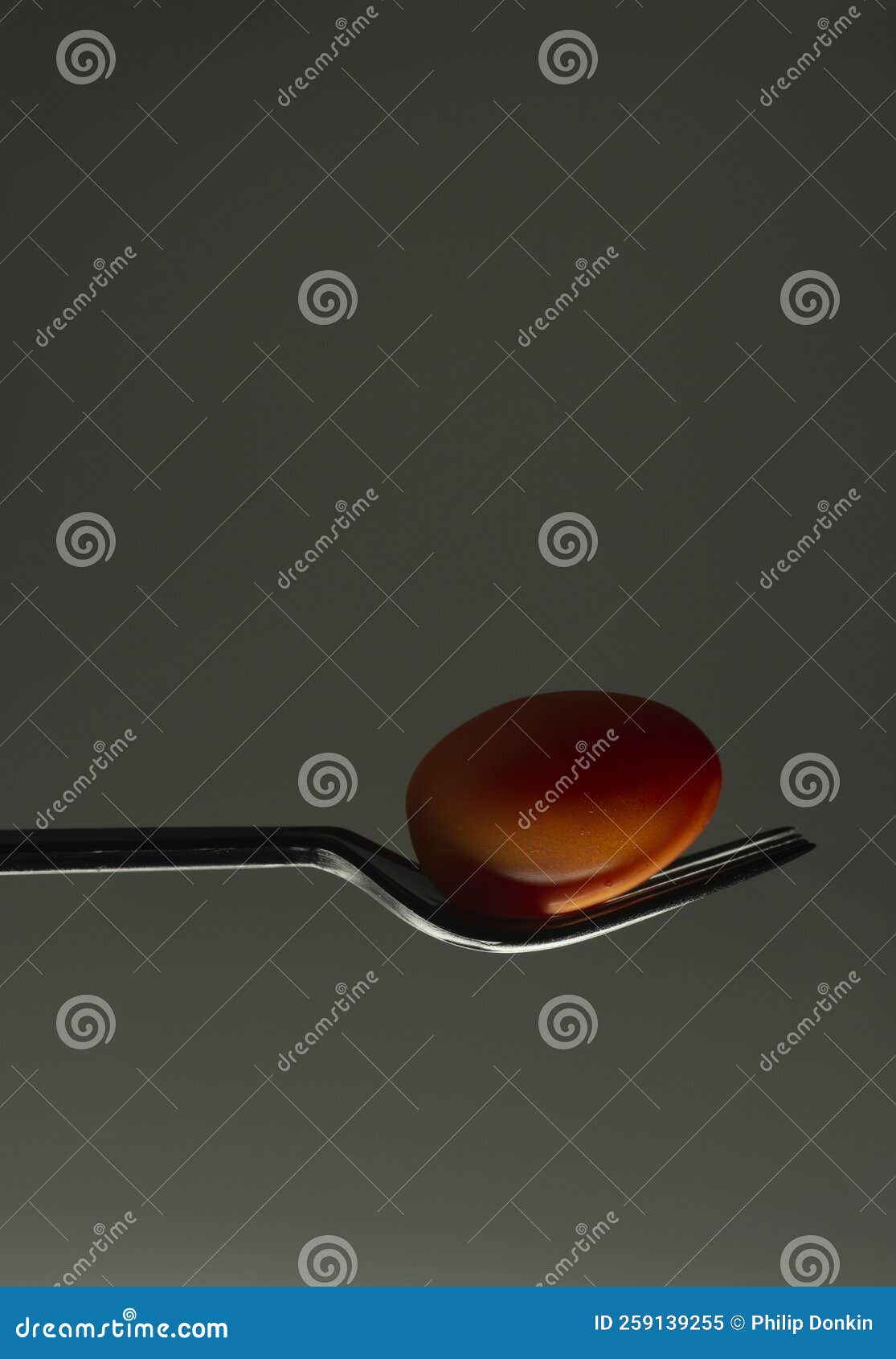 Black Plastic Fork and Spoon with Water Drops and Tomato Showing ...