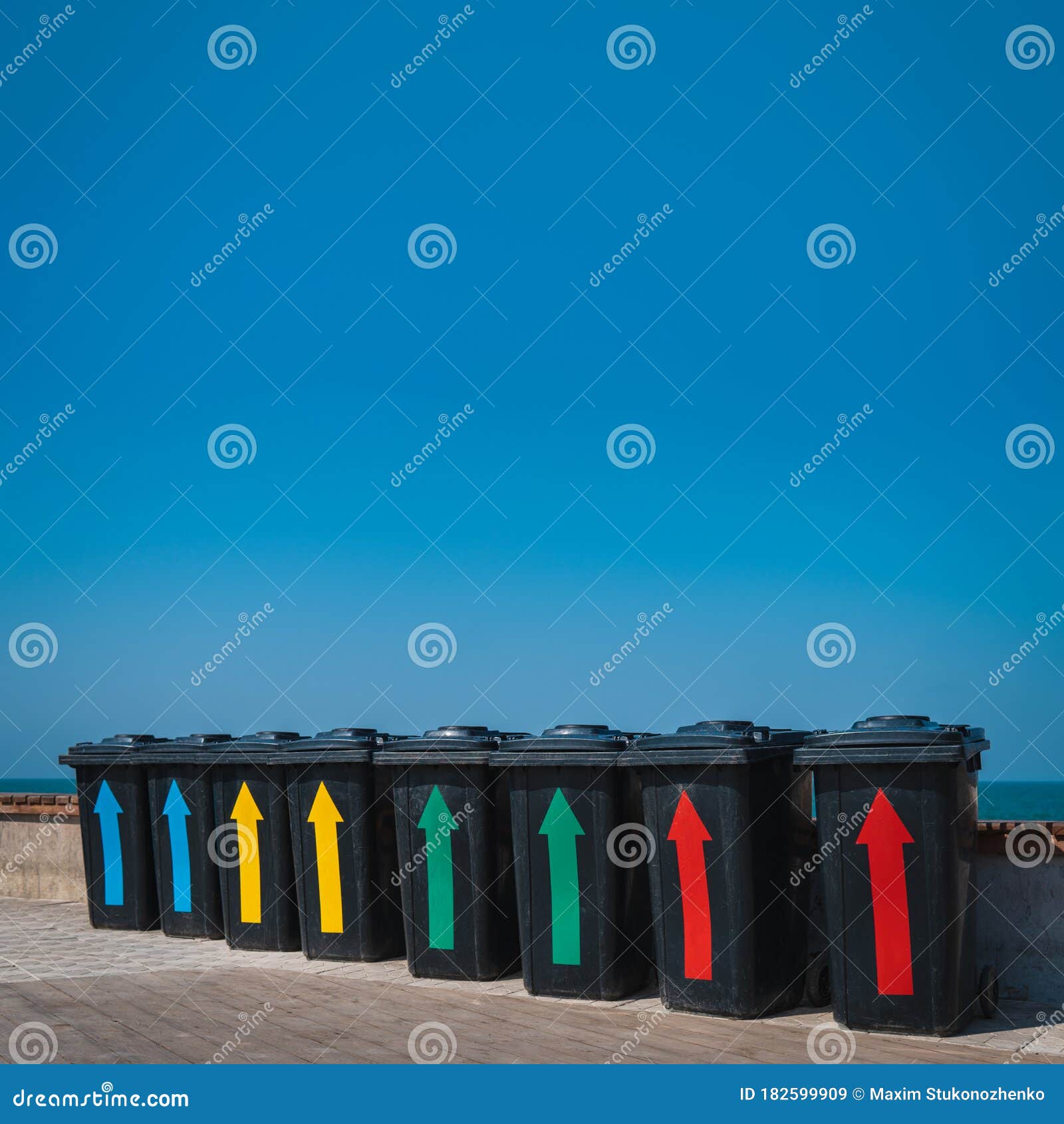 Black Plastic Garbage Cans Near the Sea. Containers for Different ...
