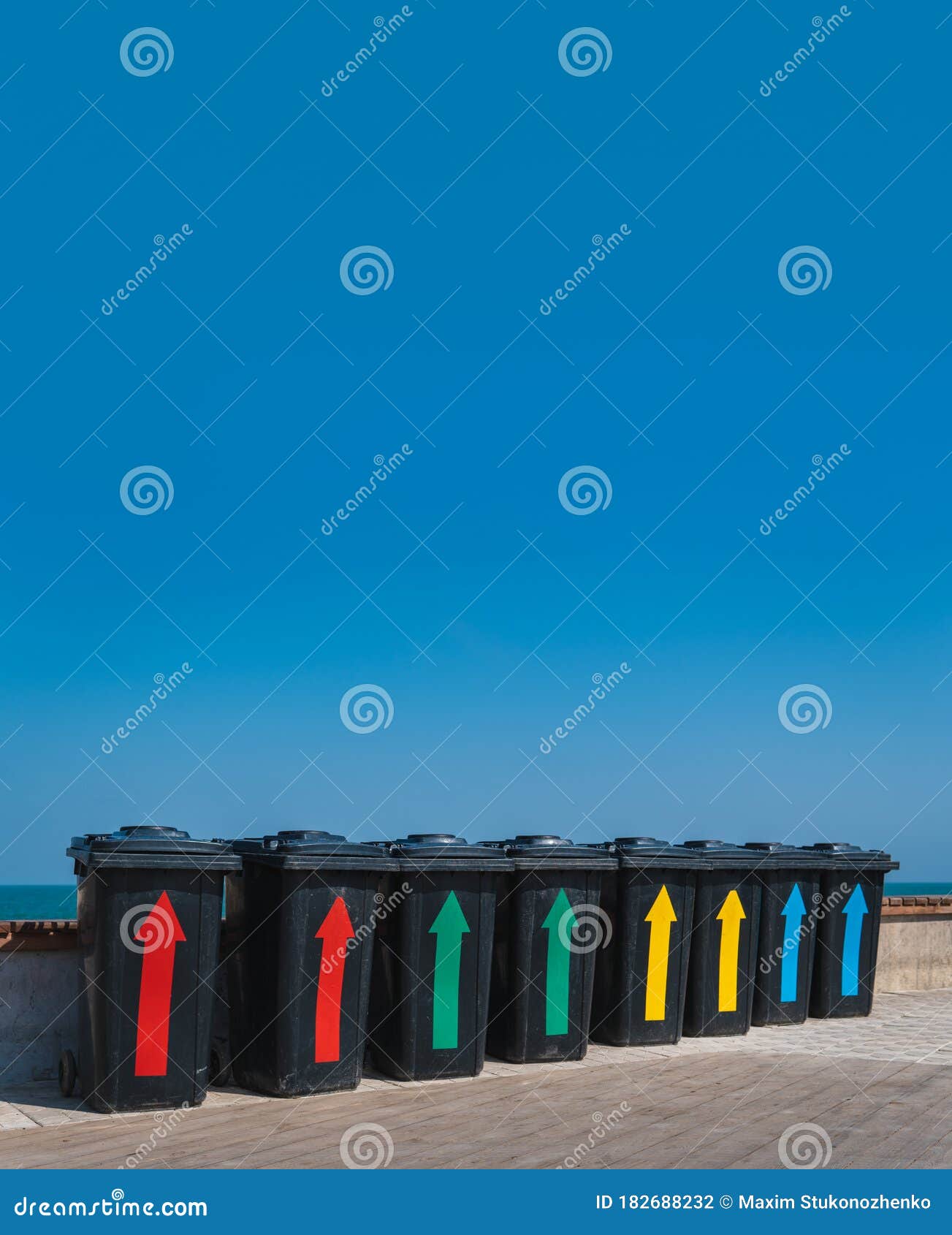 Black Plastic Garbage Cans Near the Sea. Containers for Different ...