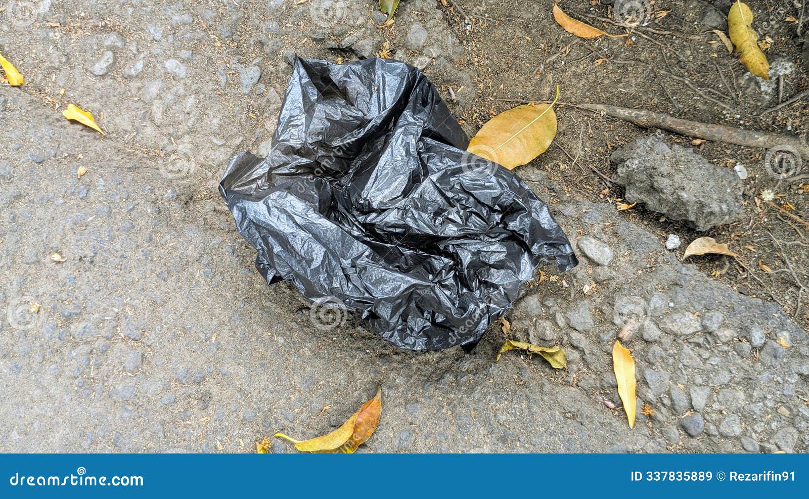Black Plastic Waste is on the Ground with Some Leaf Litter Stock Image ...
