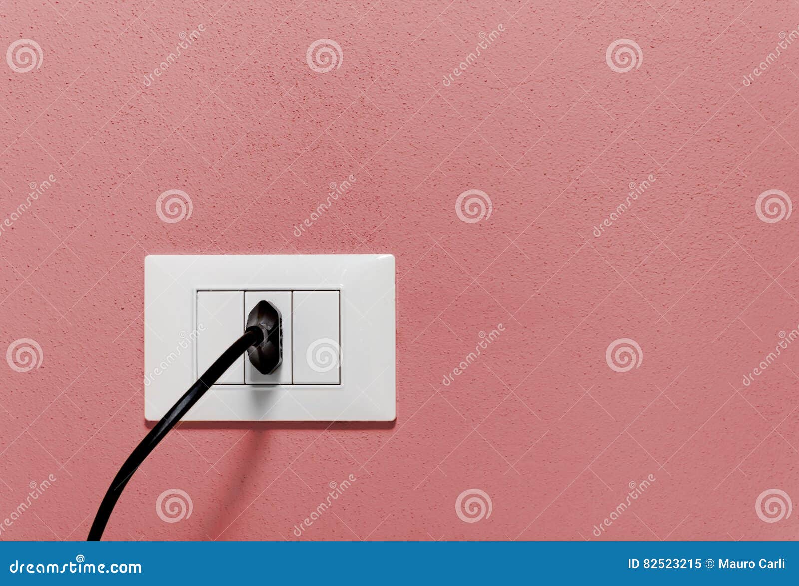 Black Plug in a Wall Socket on a Red Wall Stock Image - Image of ...
