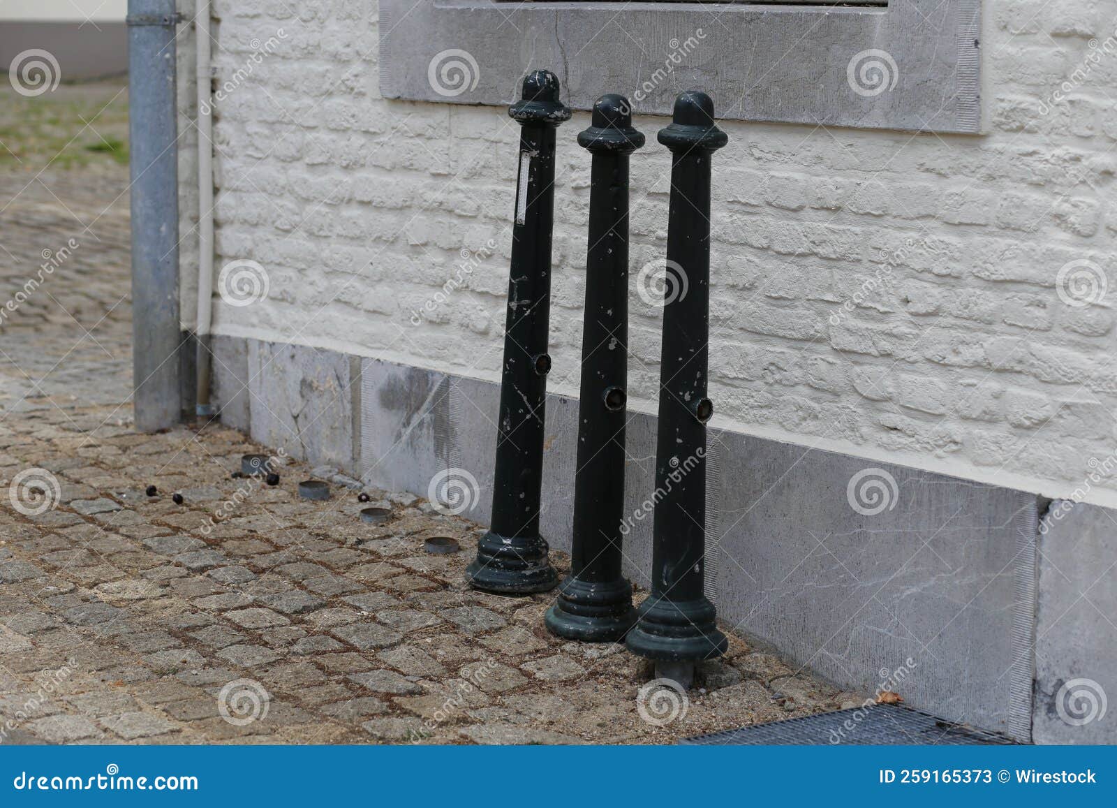 Black Poles at the White Brick Wall Stock Image - Image of environment ...