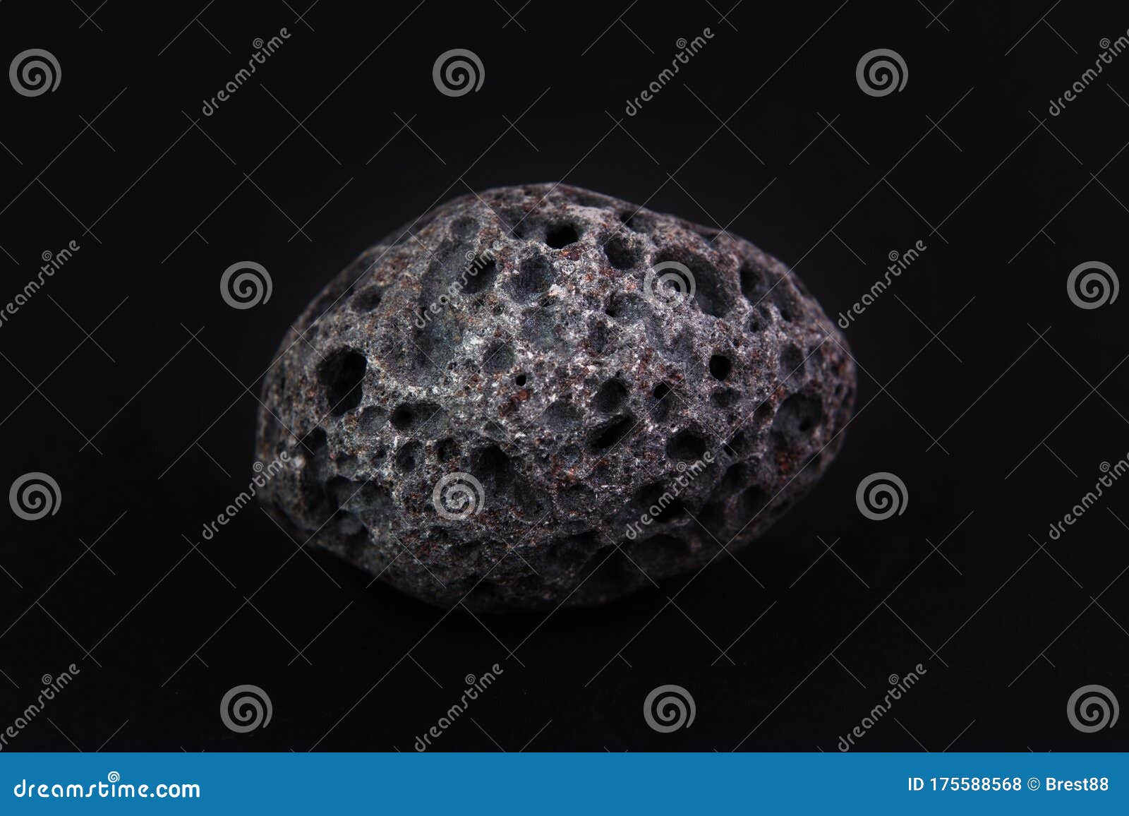 Black Porous Basalt Stone on a Black Background Stock Photo - Image of ...