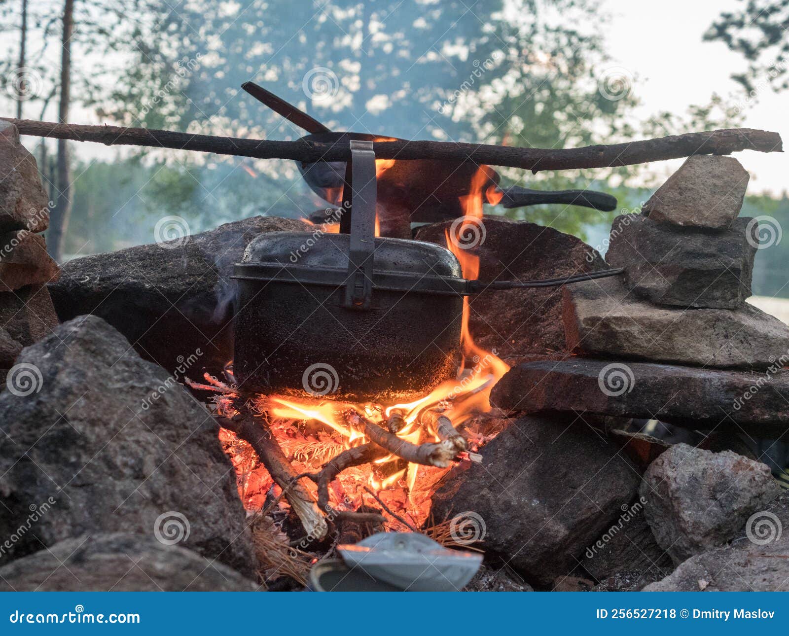 Black pot over a fire stock photo. Image of metal, wilderness - 256527218