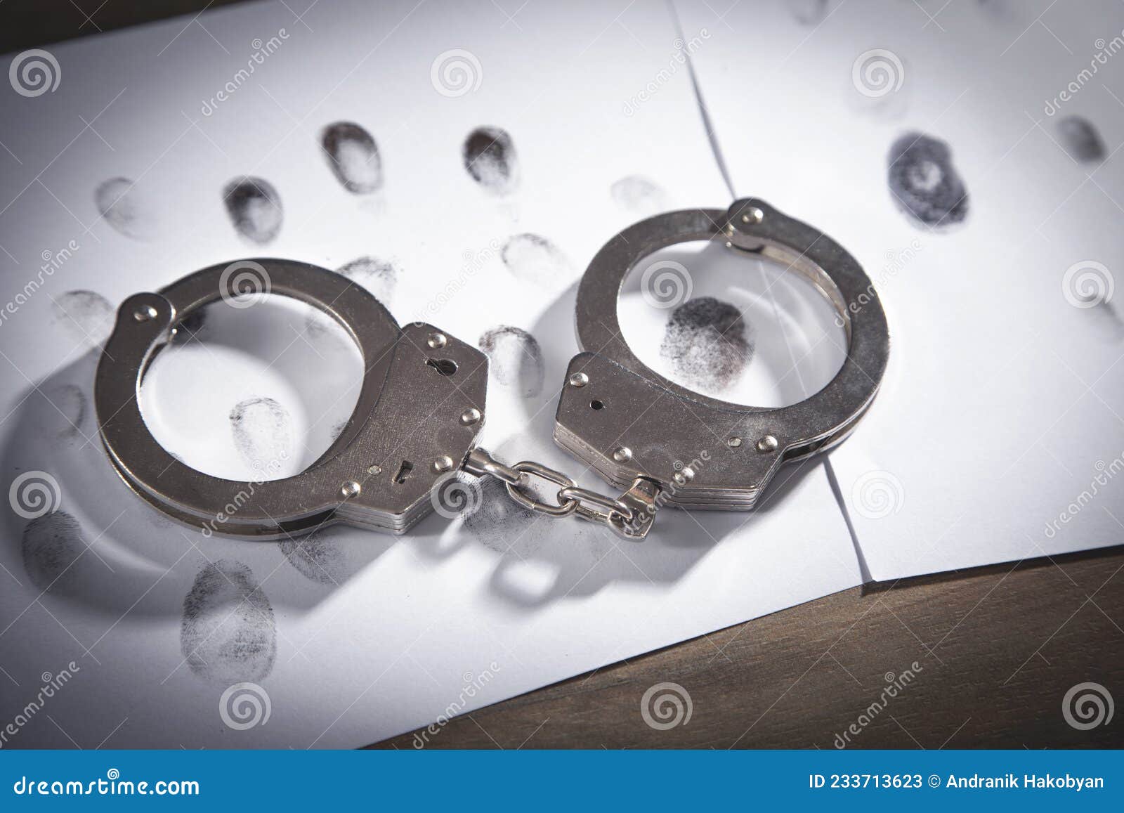 Black Prints of Fingers and Handcuffs on Paper Stock Image - Image of ...