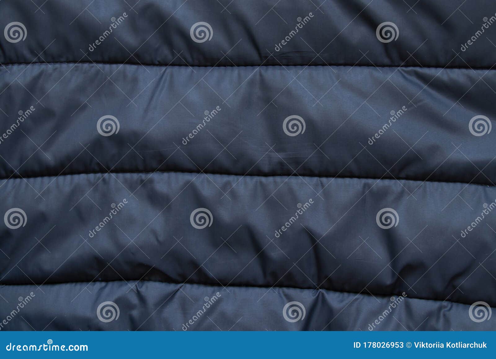Black Puffer Jacket Material As Background Closeup Stock Image - Image ...