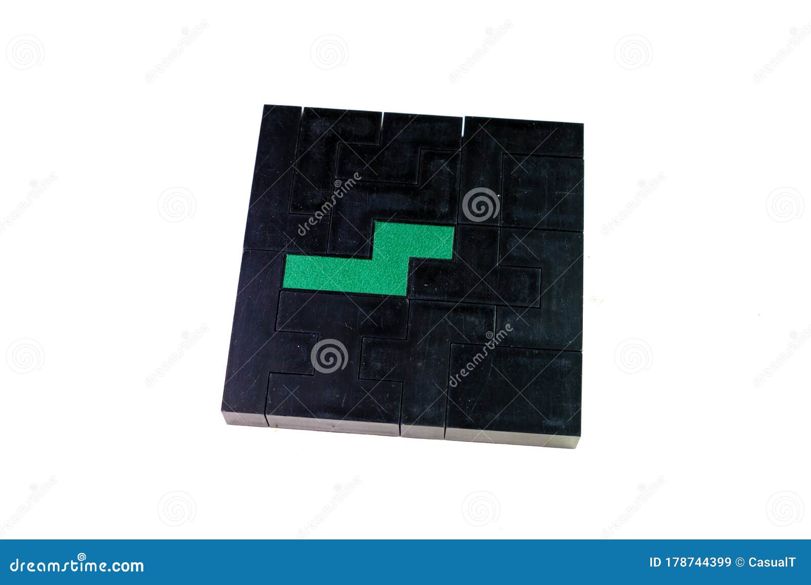 Black Puzzle Made of Plastic Blocks, that Has only One Colored Piece ...