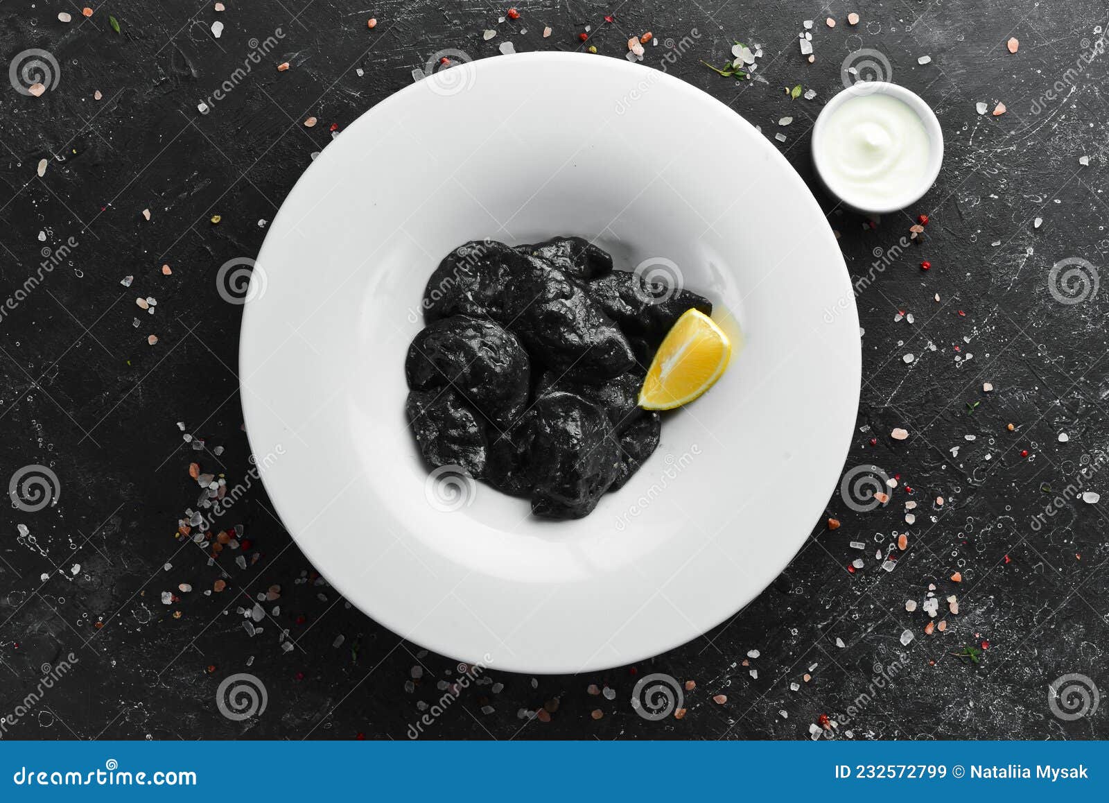 Black Ravioli with Meat and Sauce, on a White Plate. Stock Image ...