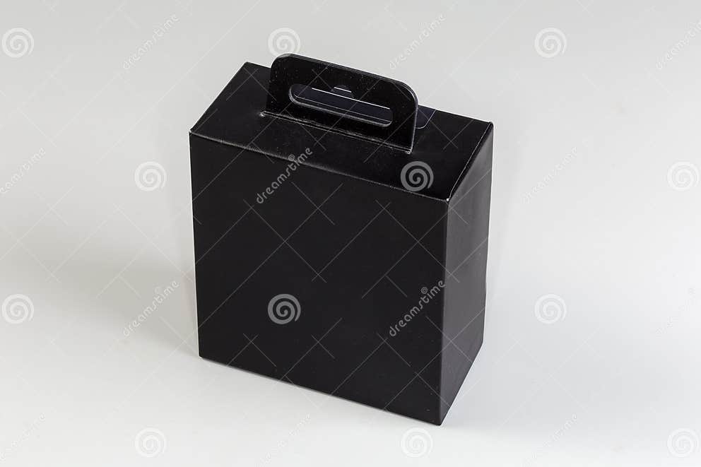 Black Rectangular Cardboard Hang Tab Packing Box on Gray Surface Stock ...