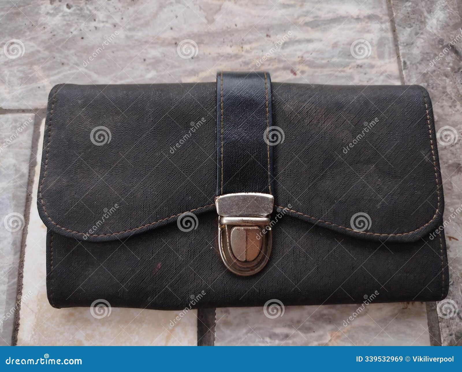 A Black Rectangular Wallet that is Dusty but Doesn& X27;t Lose Its ...