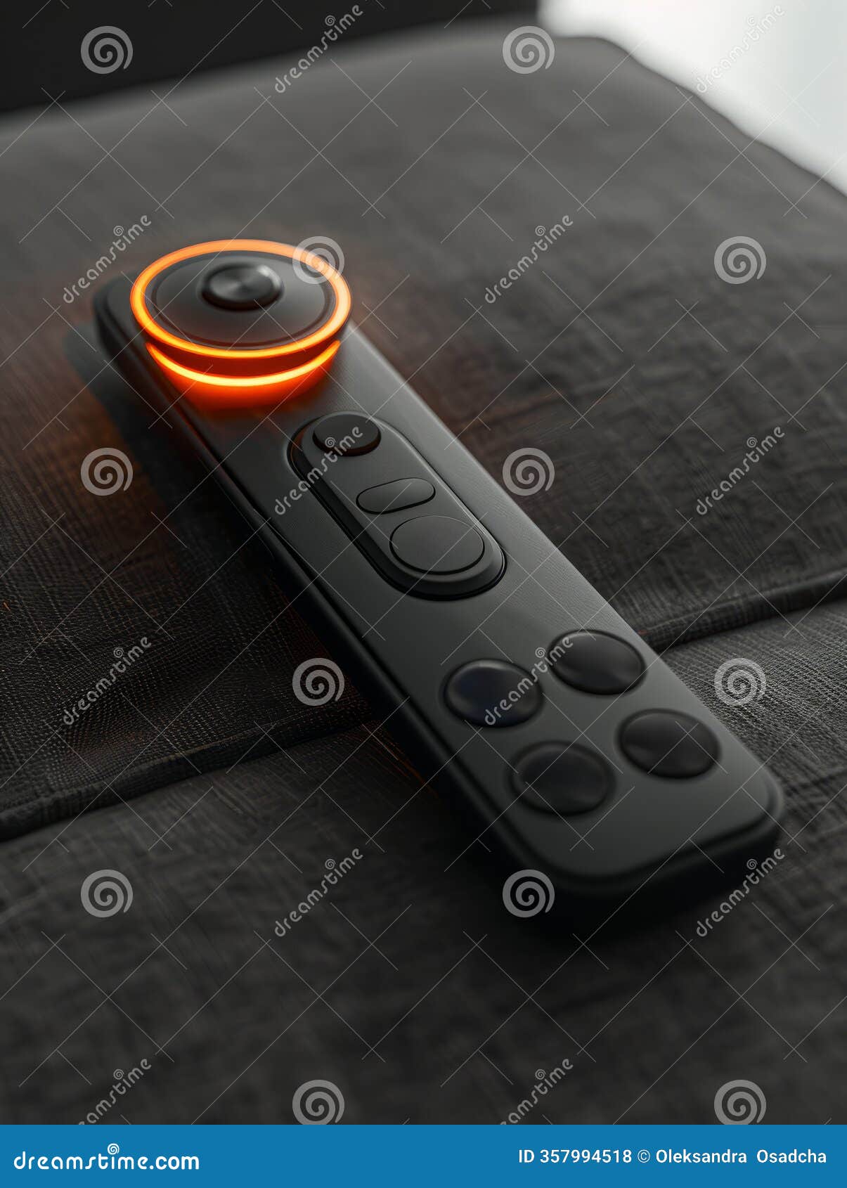 A Black Remote Control with an Illuminated Circular Button. Stock Photo ...