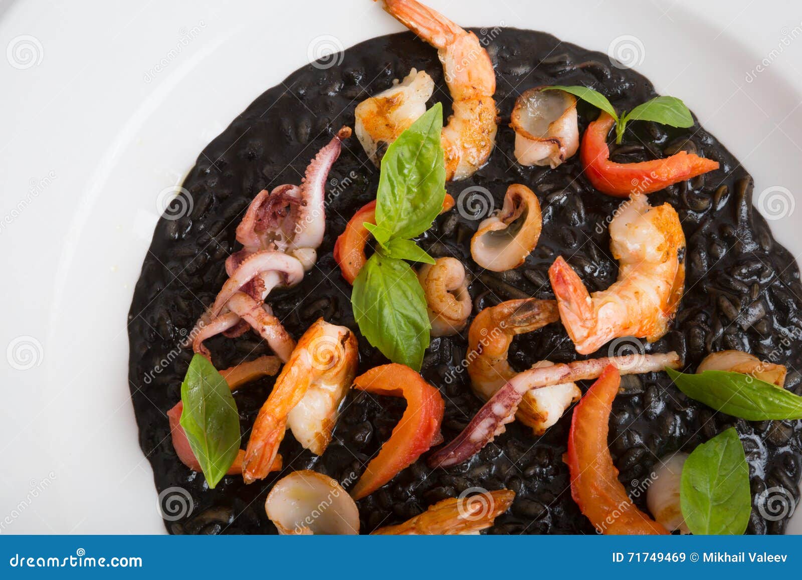 Black risotto with seafood stock image. Image of dish - 71749469