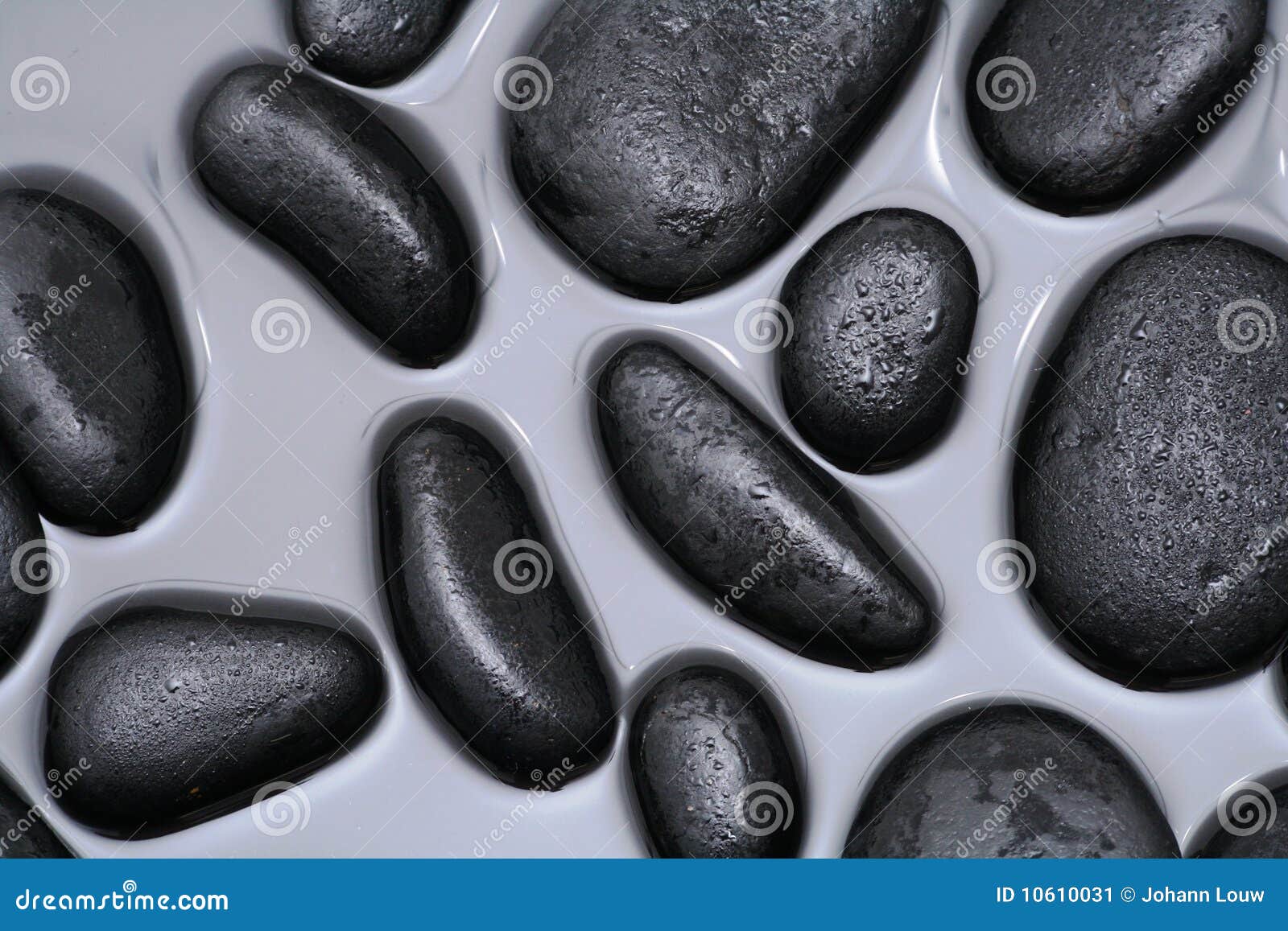 Black Rocks in Water stock image. Image of black, stones - 10610031