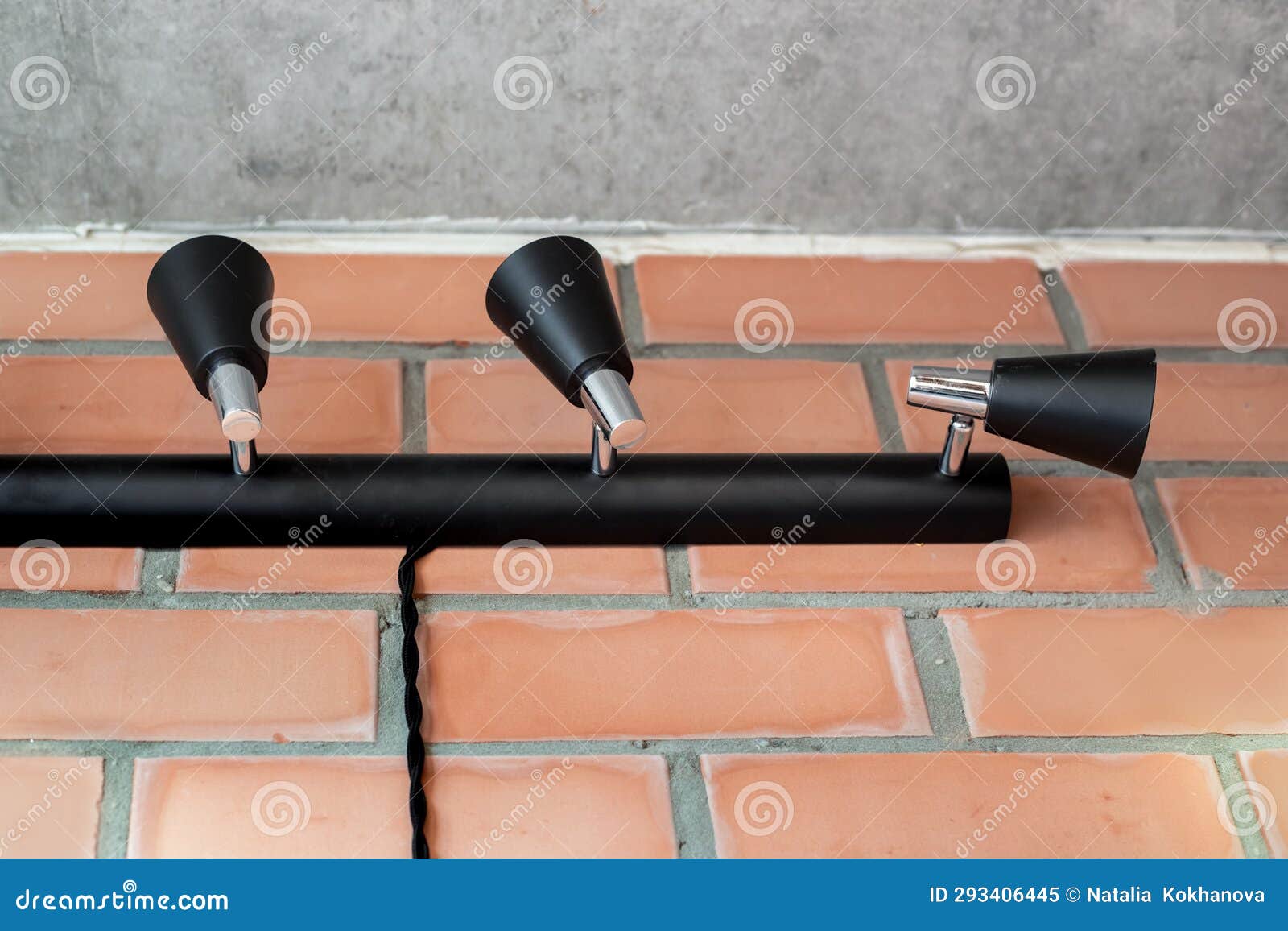 Black Rotary Lamps on a Black Rod on a Brick Wall. Lighting Design ...