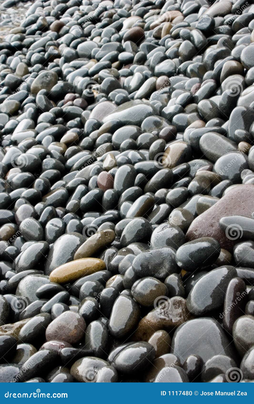 Black rounded stones stock photo. Image of multiple, vertical - 1117480